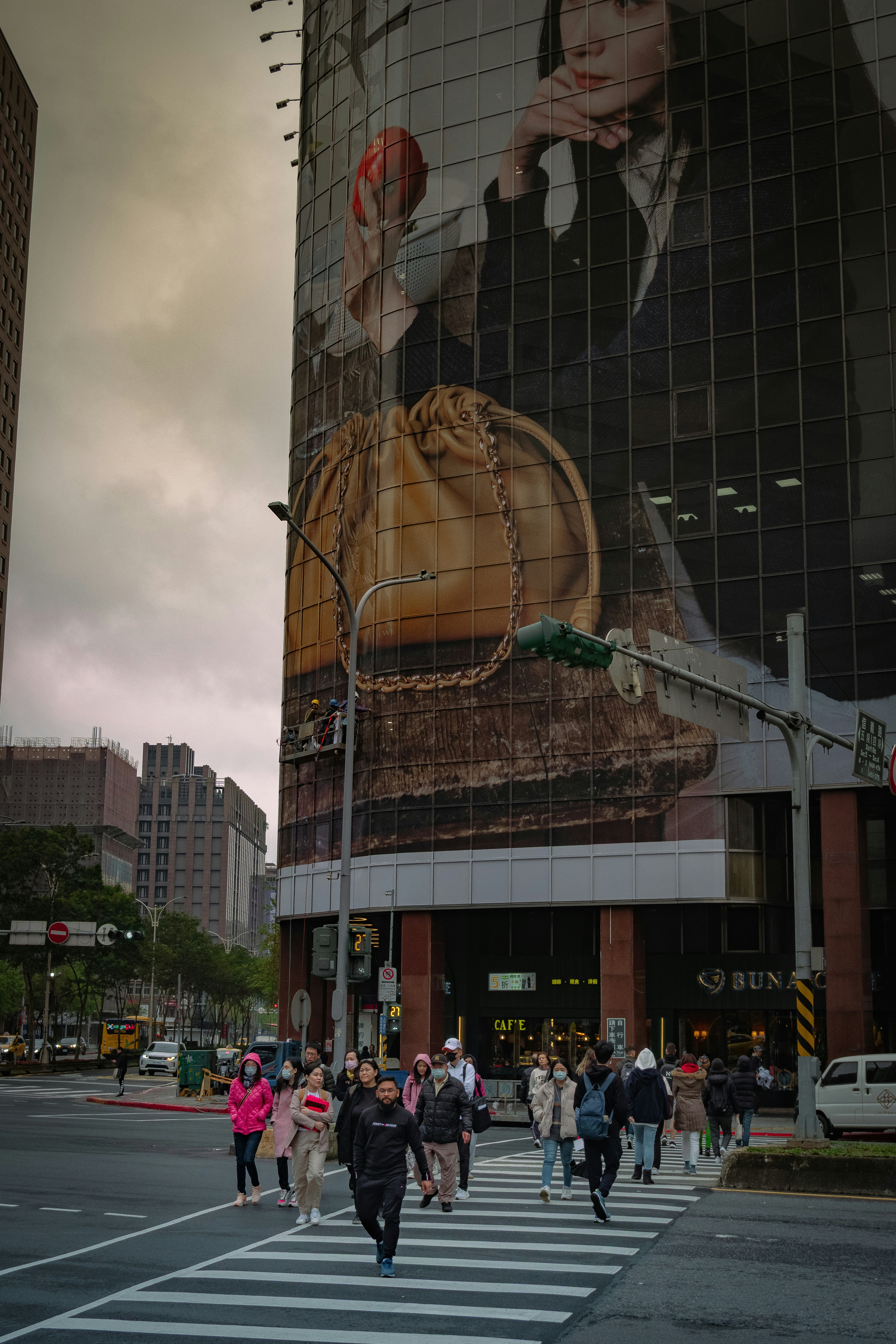 Crosswalk Chorus in Front of a Giant Bust: Urban Echoes