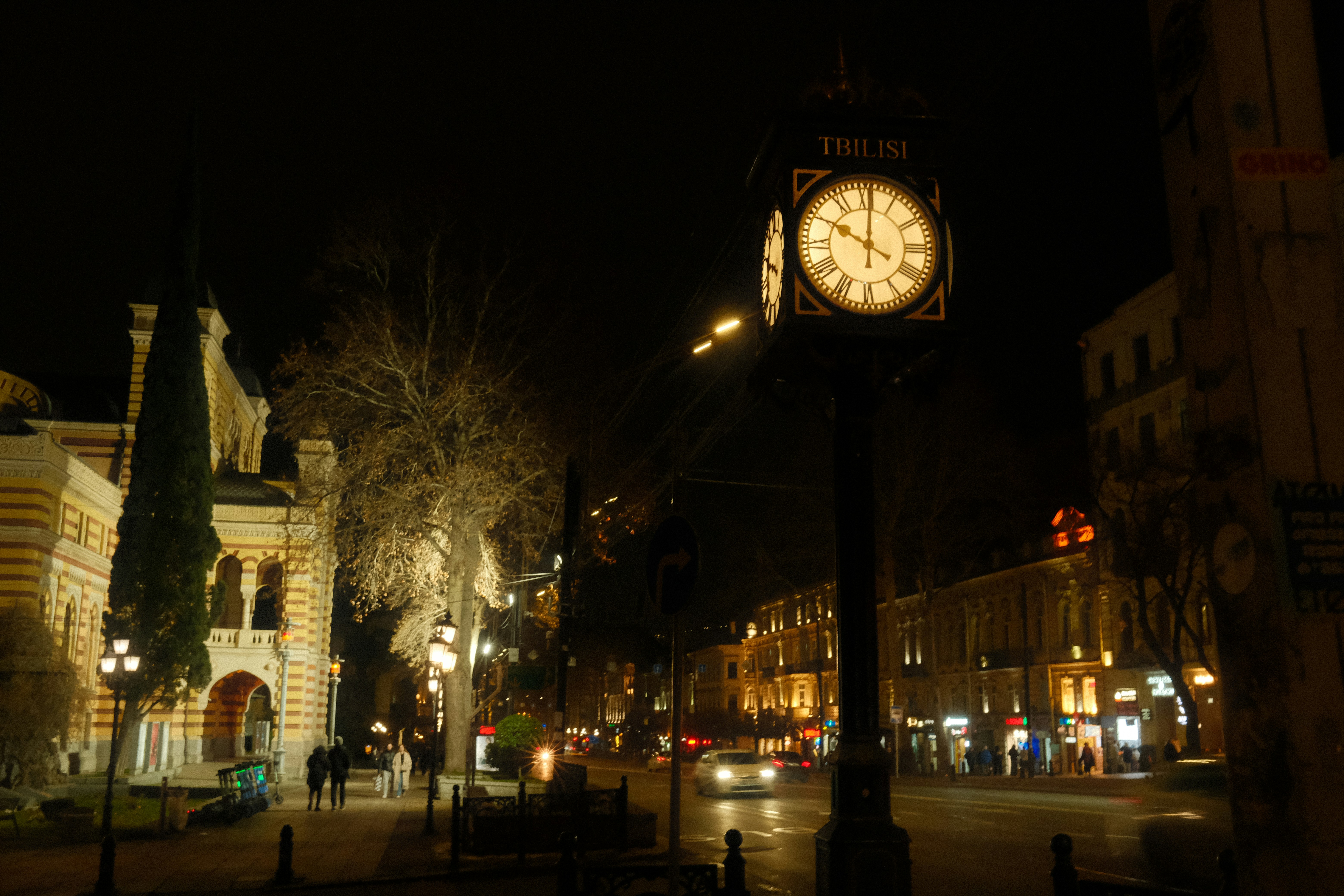 Timeless Clock Tower Amid Nightfall on a Quiet City Street
