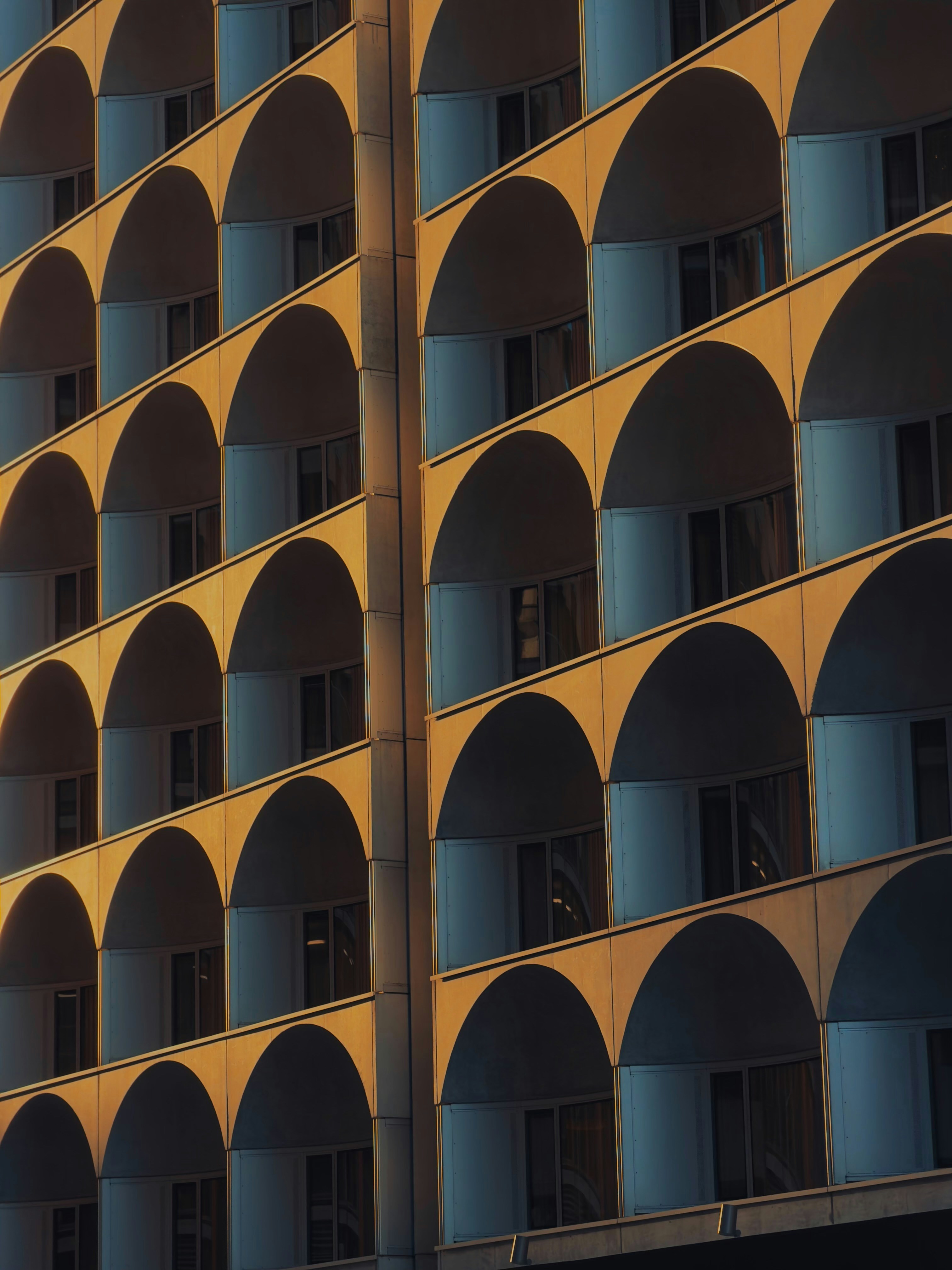Sunlit Arcades: Repeating Curves of a Modern Facade