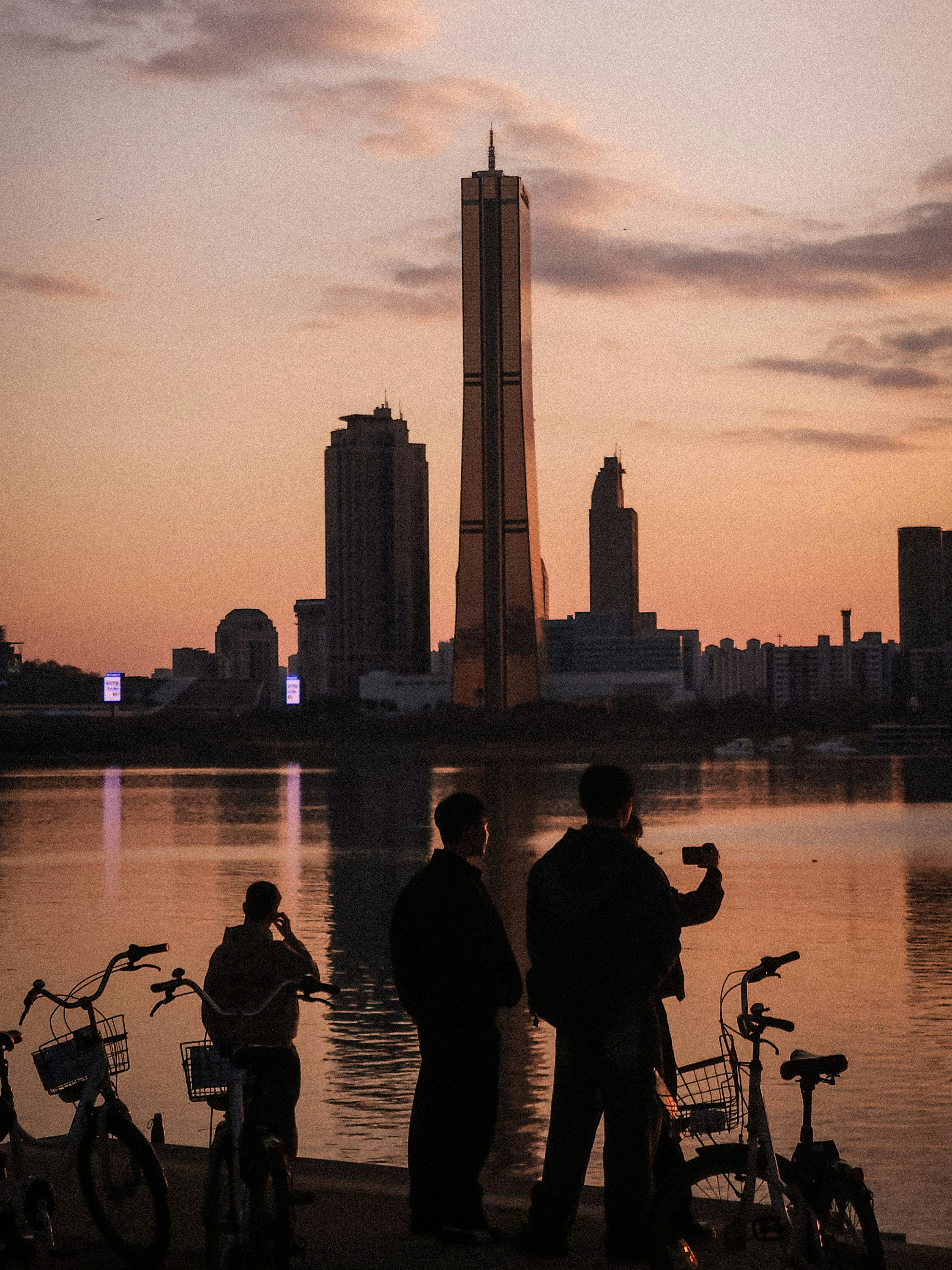 Evening by the Pier: silhouettes and skyline at sunset