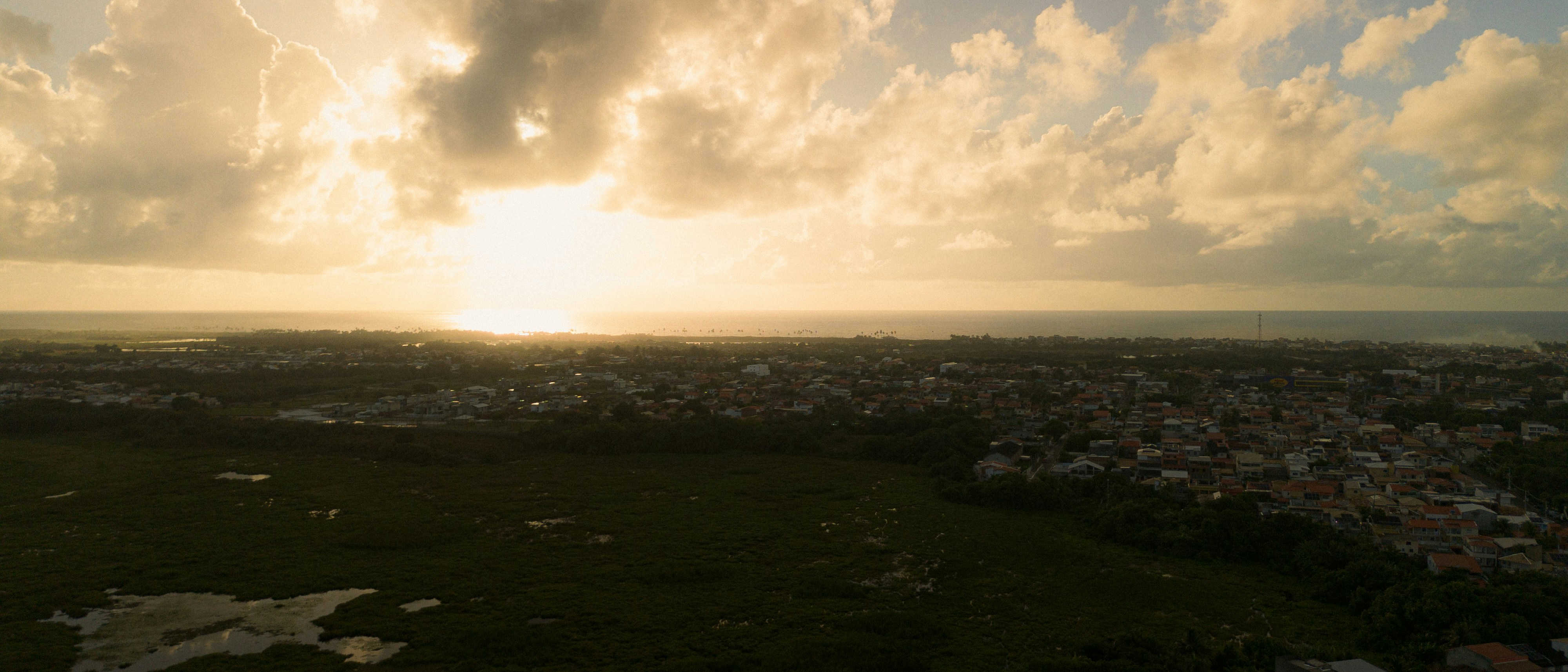 Horizon Glow Over Coastal Plain at Sunset