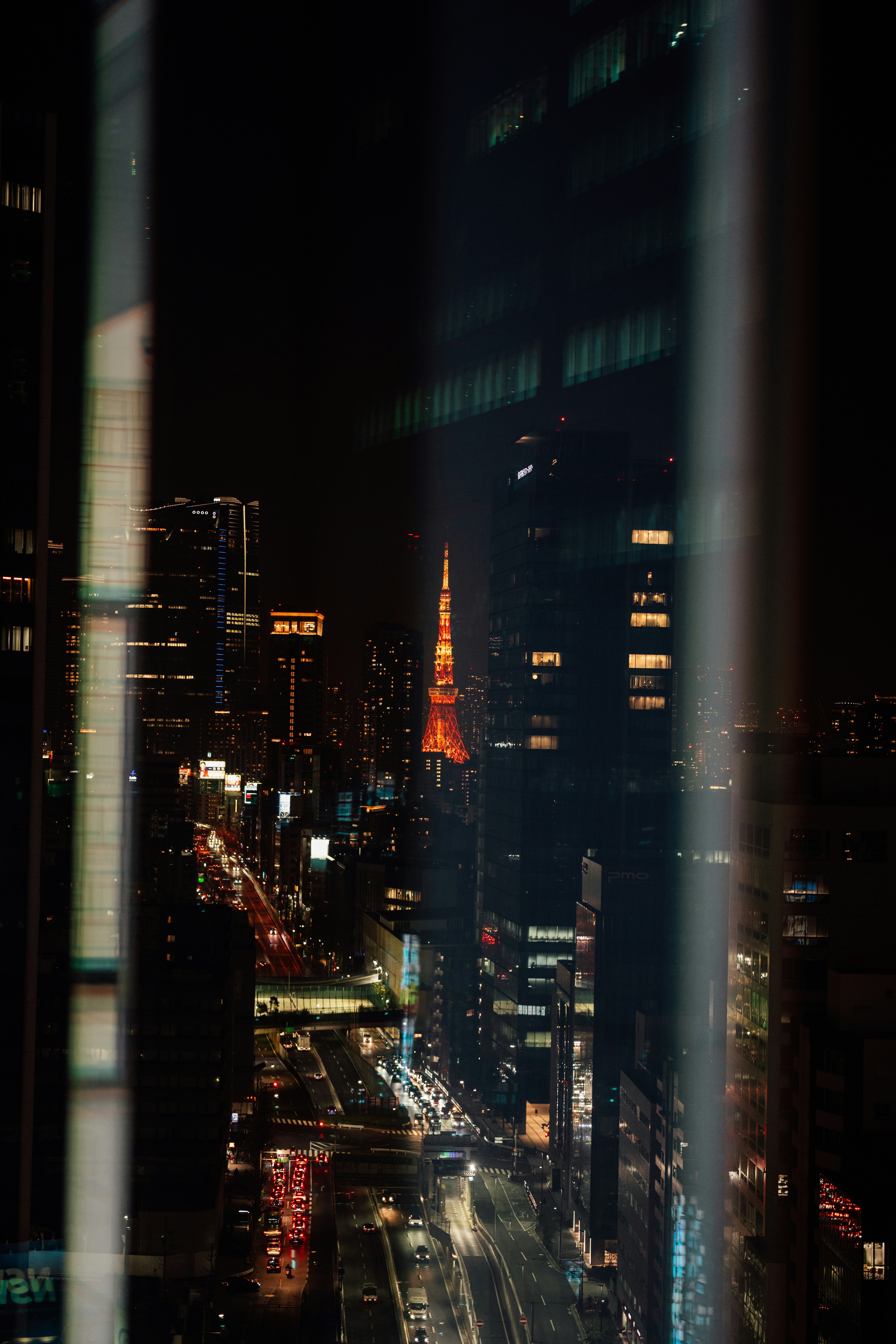 City Light Through Glass: Tokyo Tower Piercing the Night