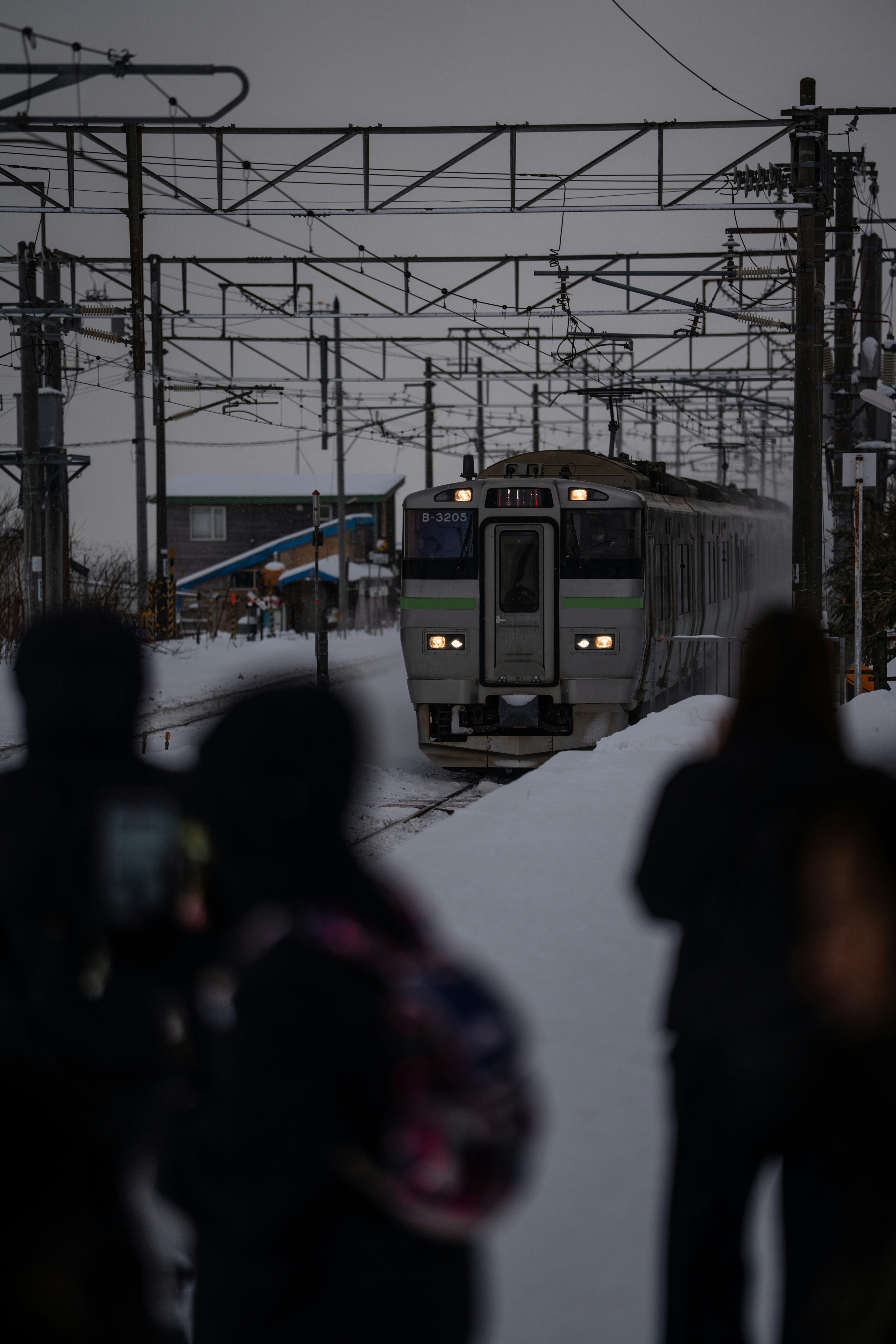 Locomotive Arrival in a Snowlit Platform