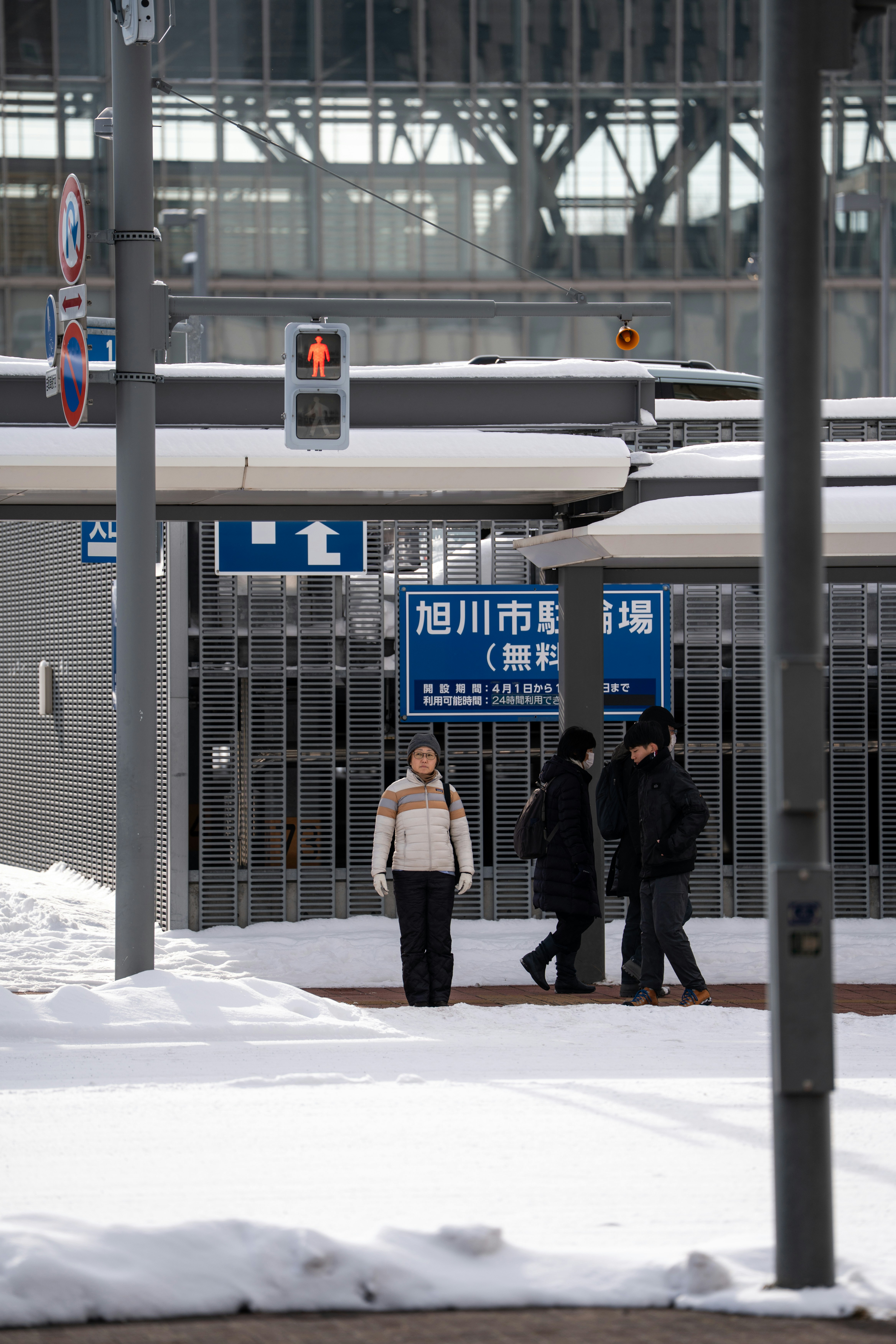 Snowy Station Threshold: Strangers and Signs Beneath a Quiet Sky