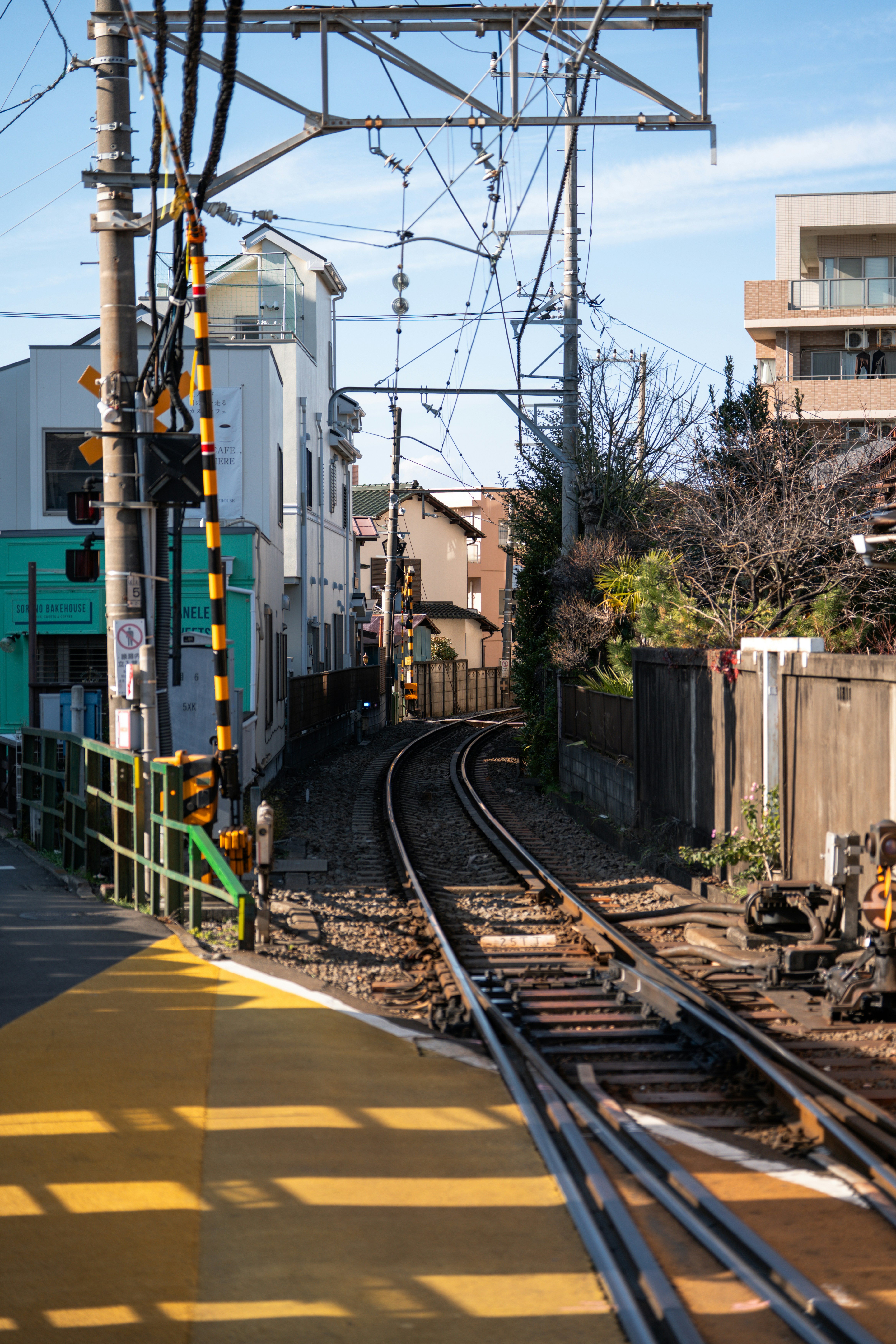 Railway Avenue: Tracks Leading to a Quiet Urban Horizon