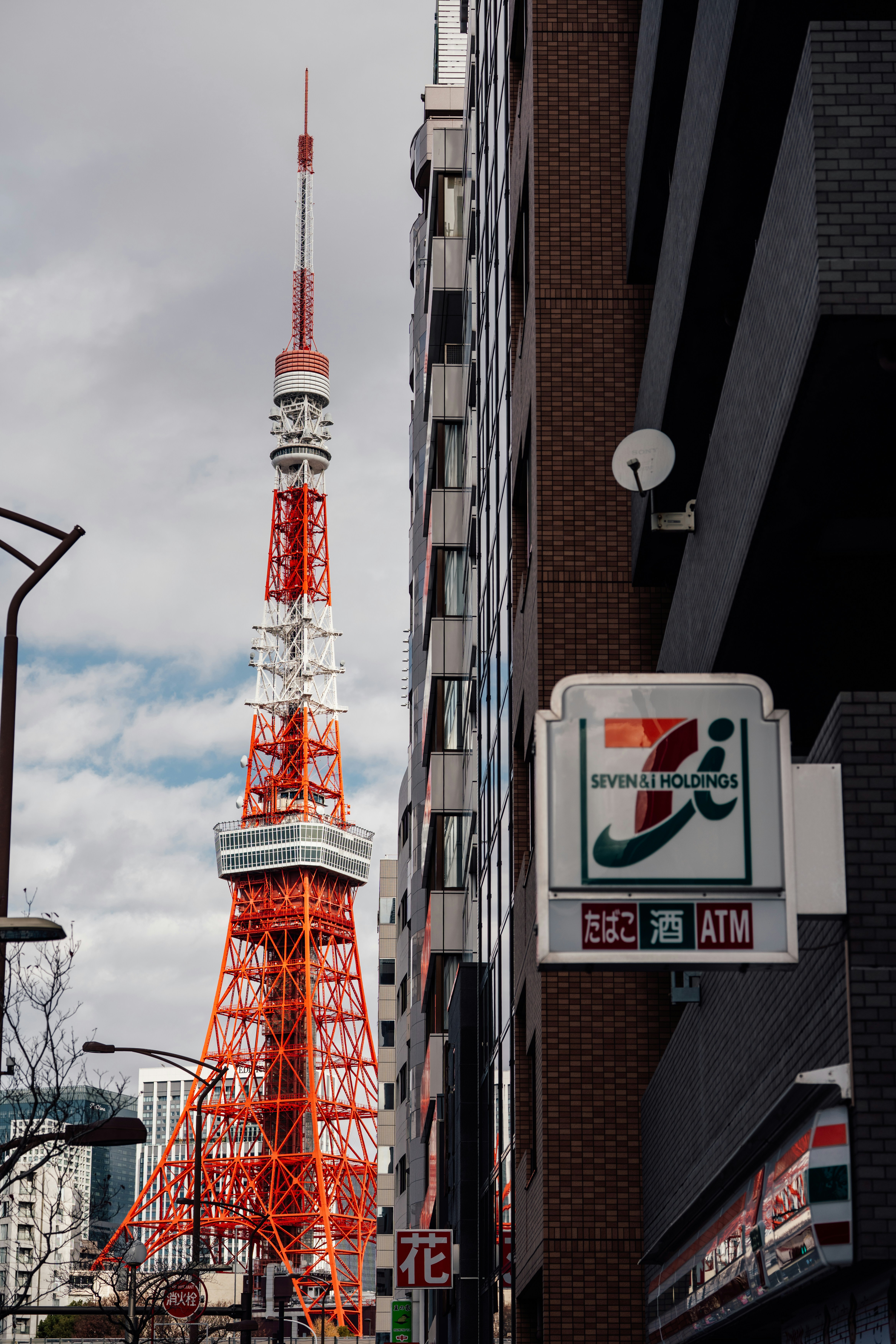 Tokyo Tower Rises Between Urban Facades