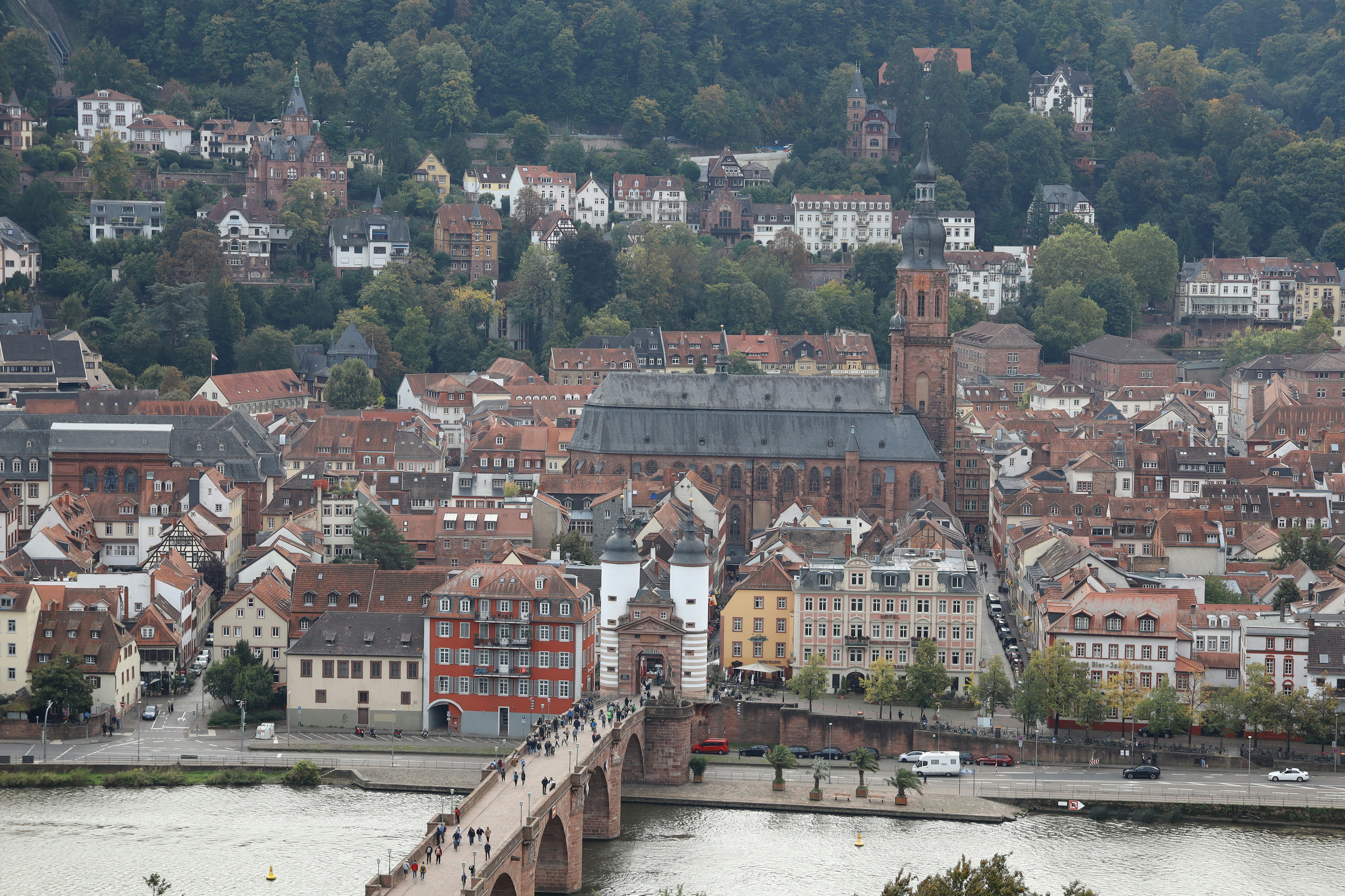 Riverside Town with Stone Bridge Under a Terraced hillside
