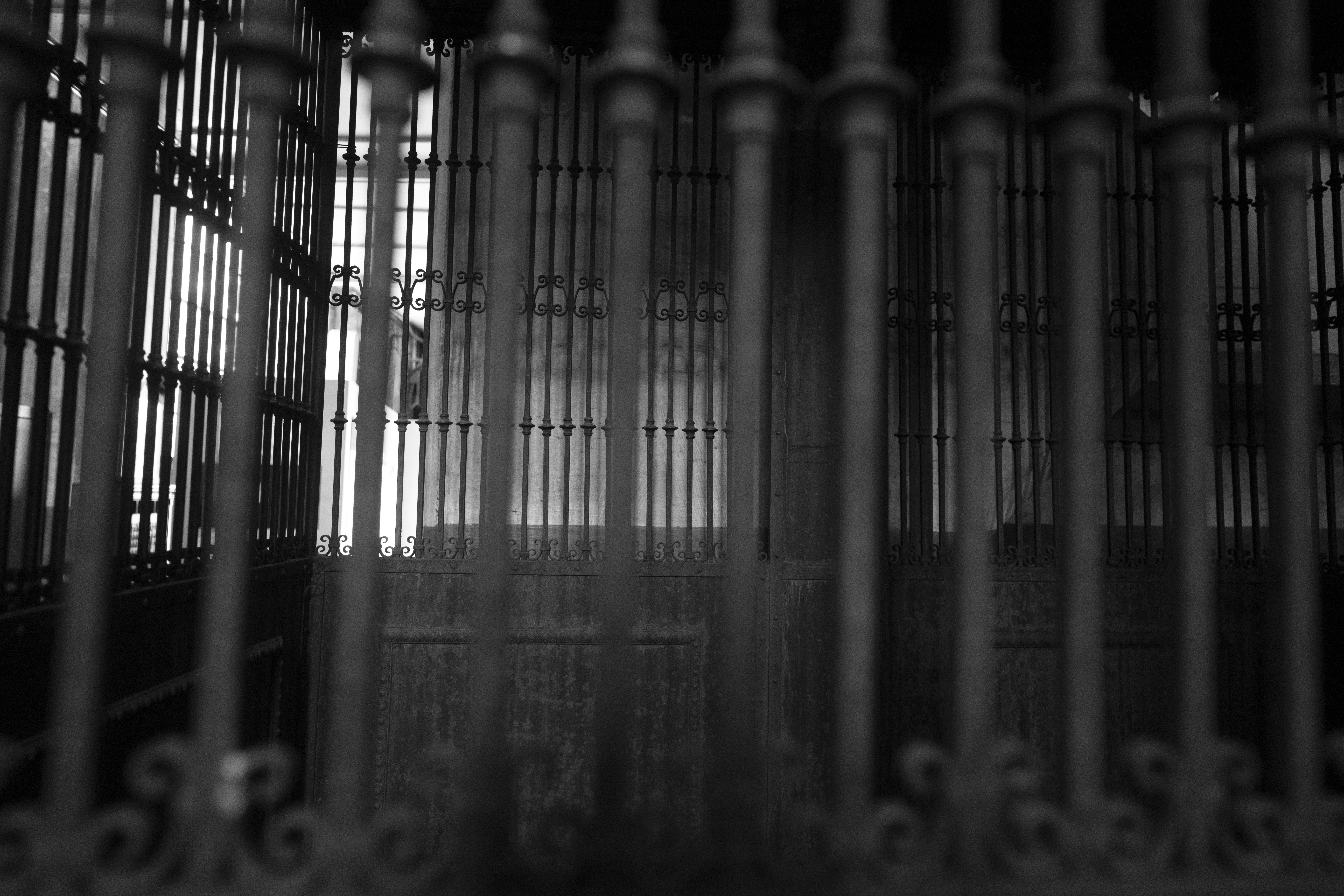 Through the Grate: a Silent Corridor of Iron and Light