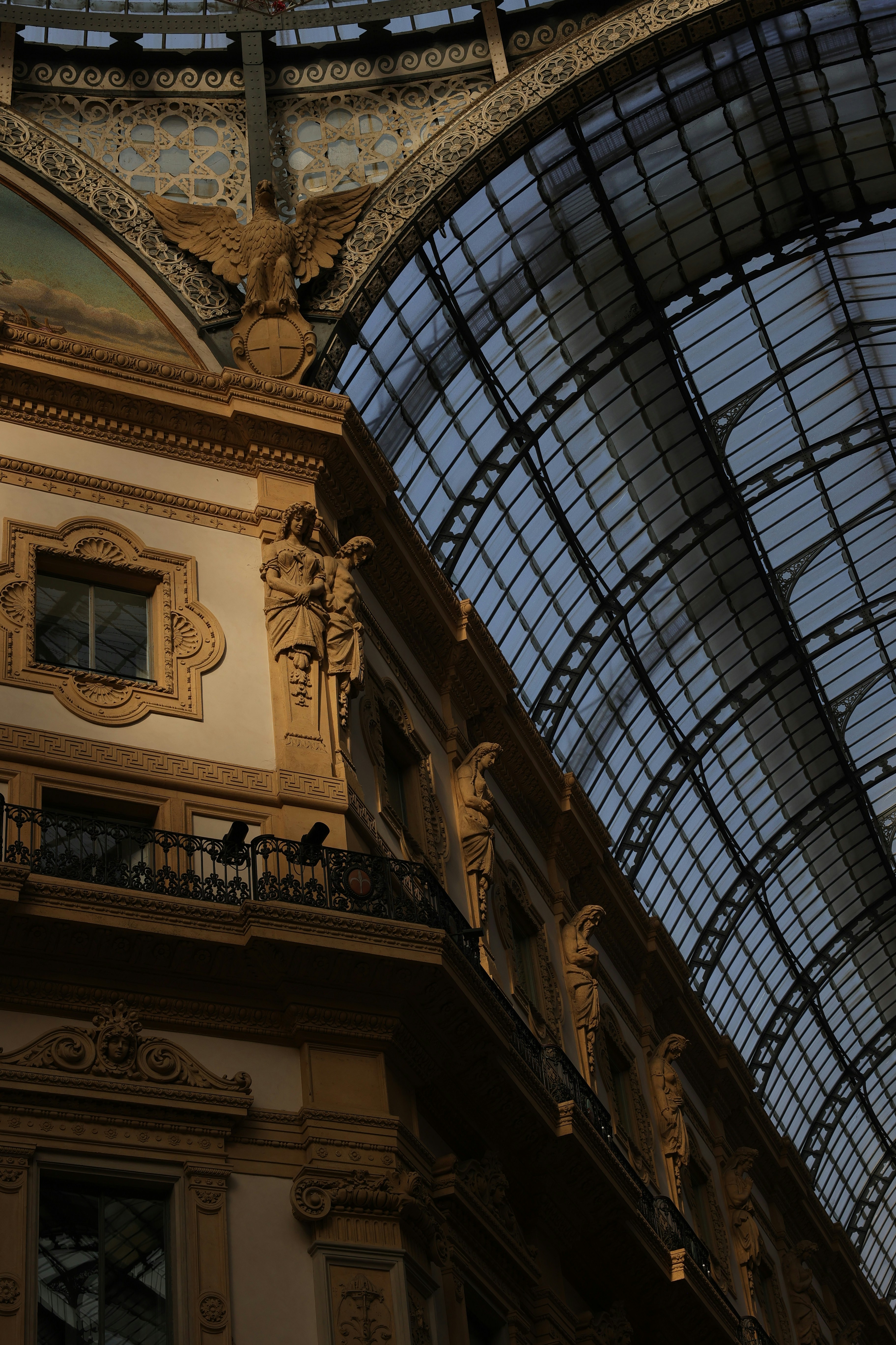 Architectural Archways and Sculptures Inside a Sunlit Glass Dome