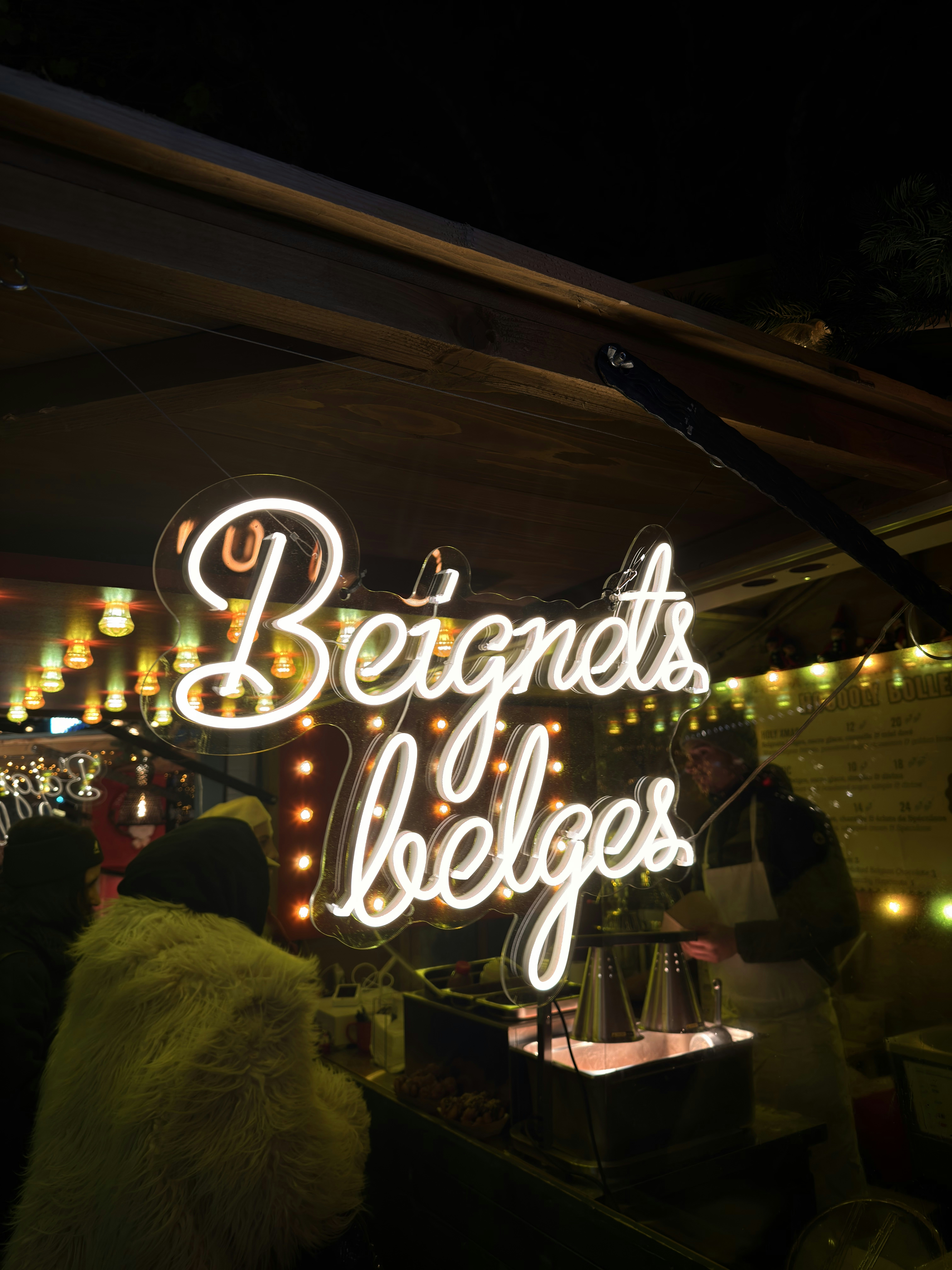 Neon Script in a Night Market Window