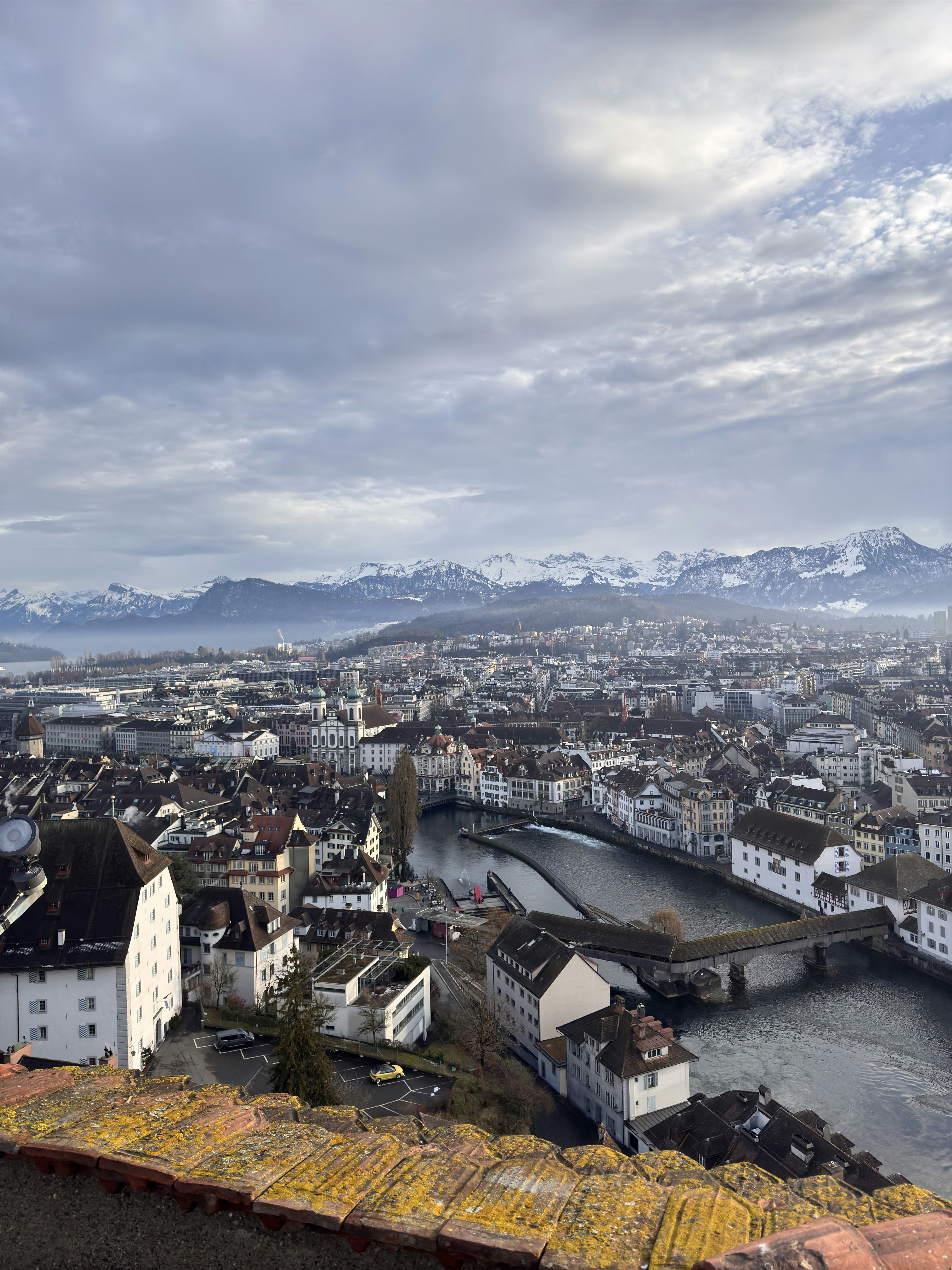 Rivertide Overlook: Medieval Roofs at the Edge of a Snow-Kissed Valley