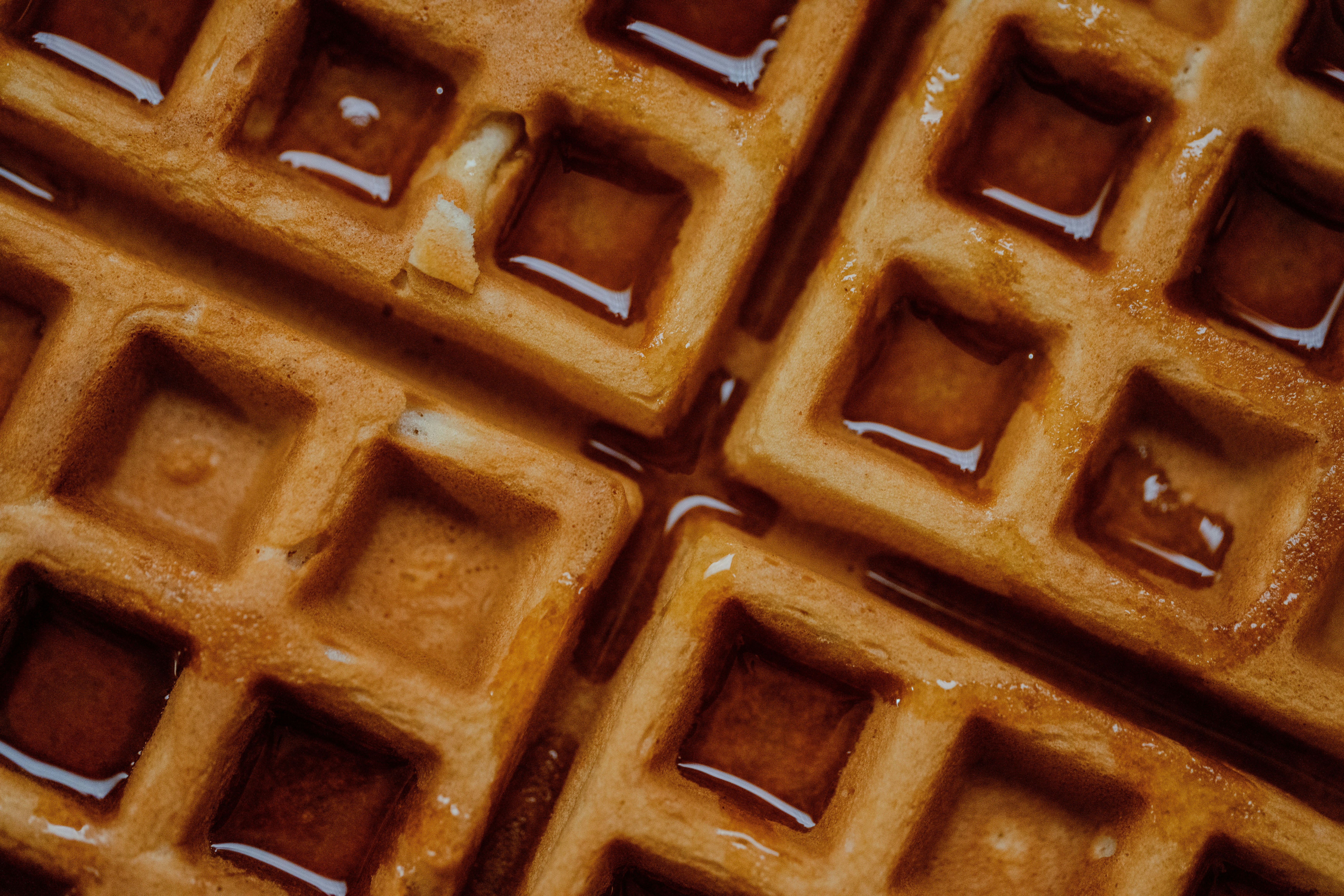 Close-Up of Golden Waffle Griddles: Interplay of Squares and Syrup Dampness