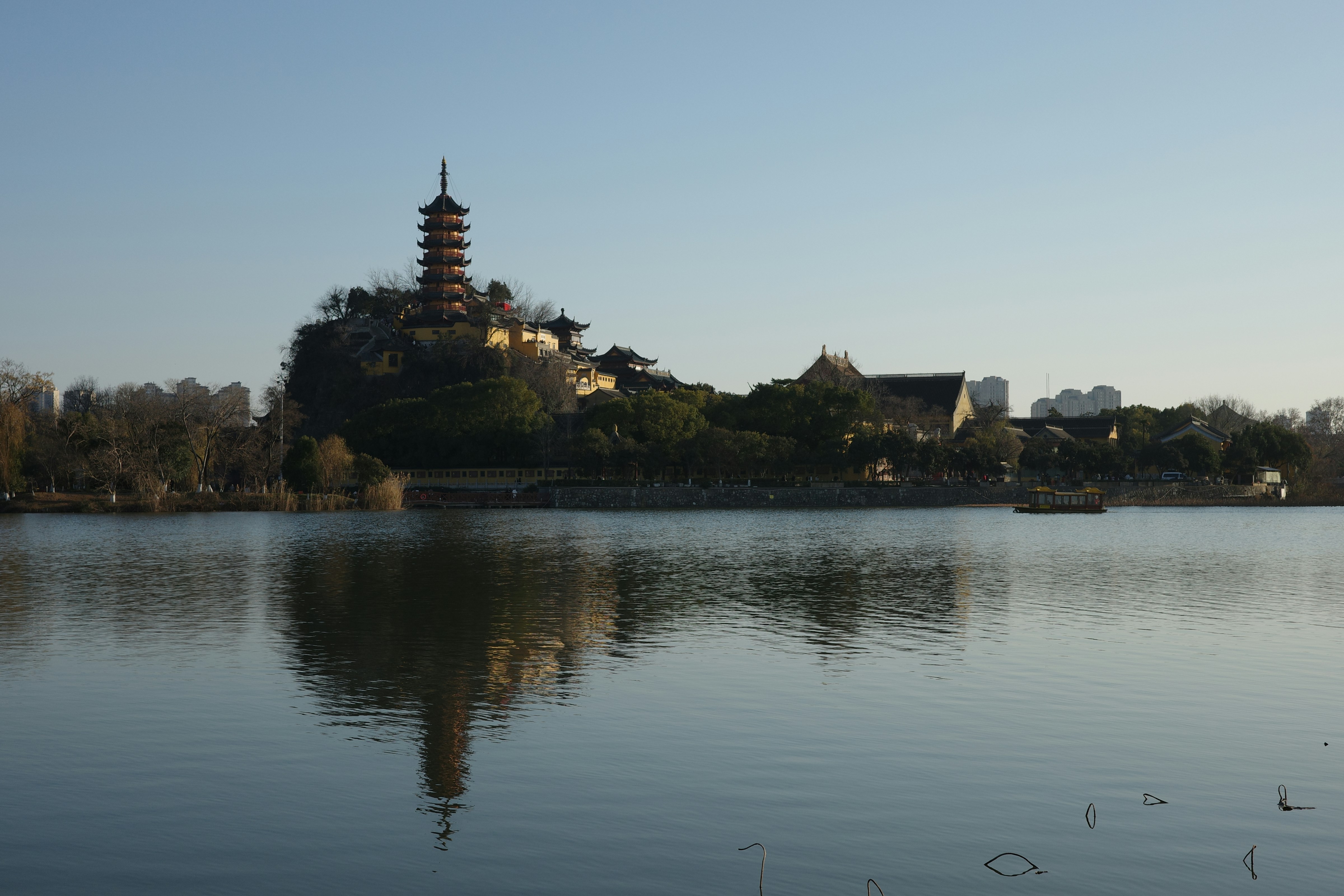 Temple on the Ridge: A Tranquil Riverside silhouette