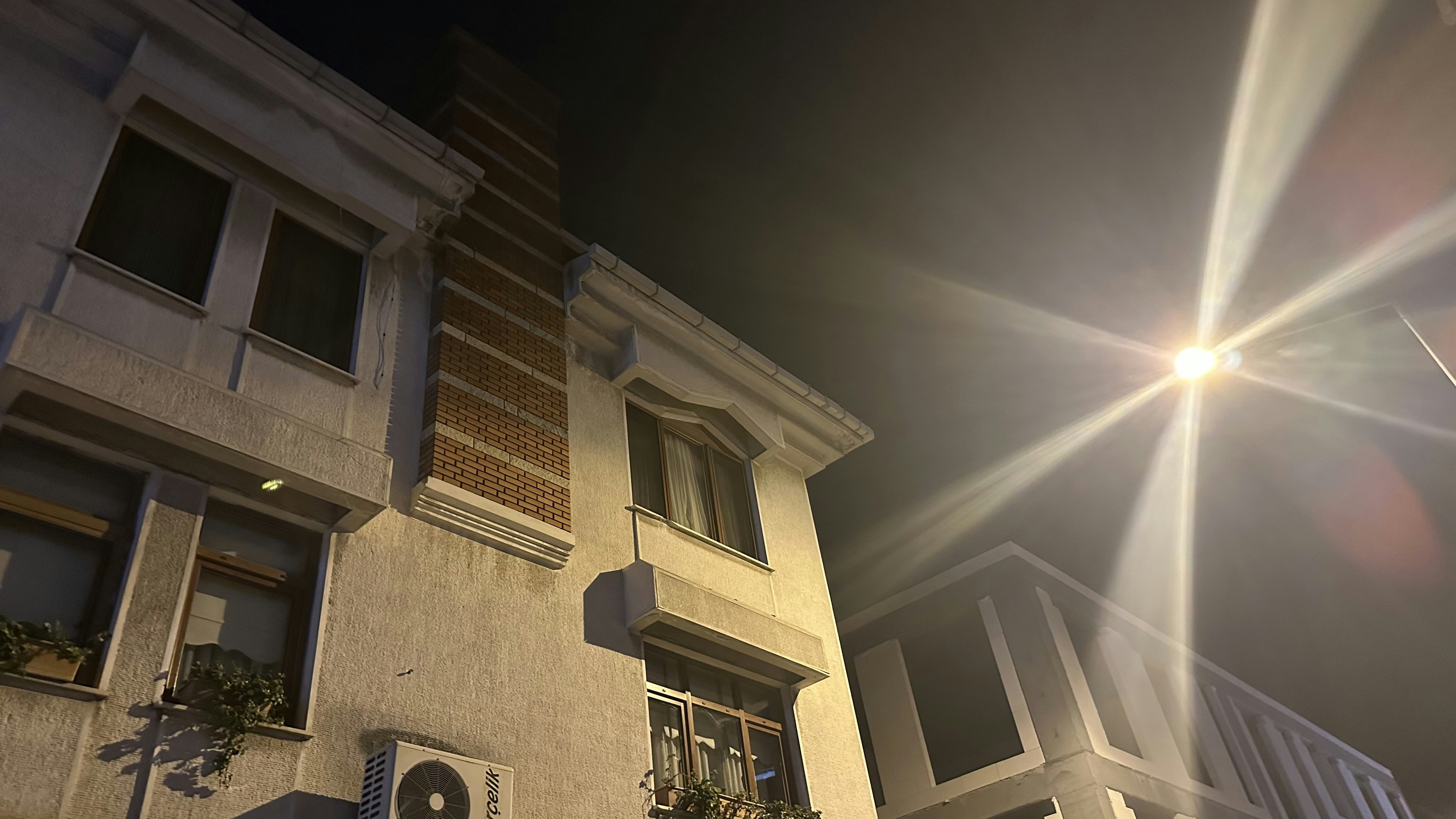 Night Streetlight Overhang: Urban Facades Under Neon Glow