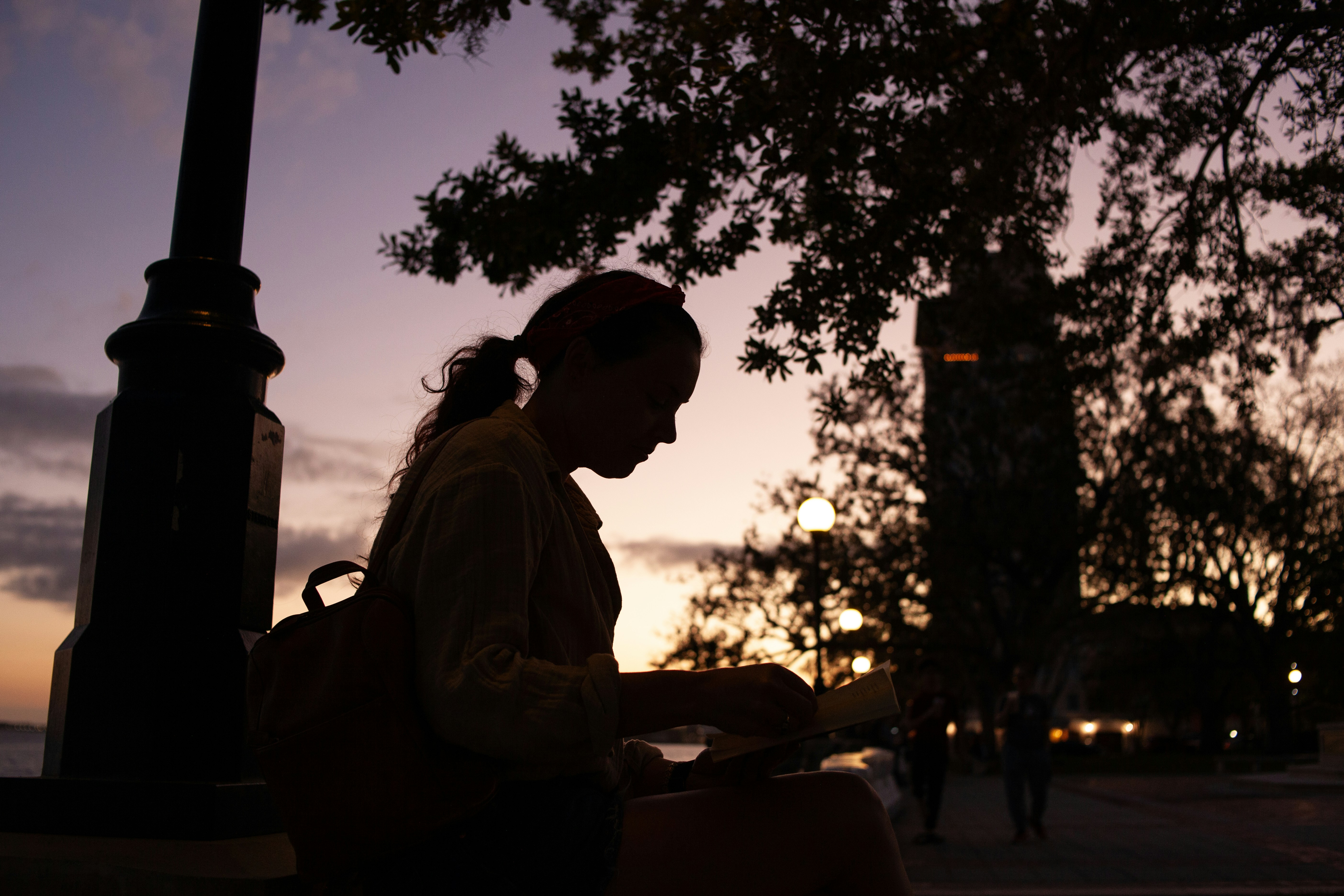 Evening Silhouette: A Quiet Moment by the Riverside