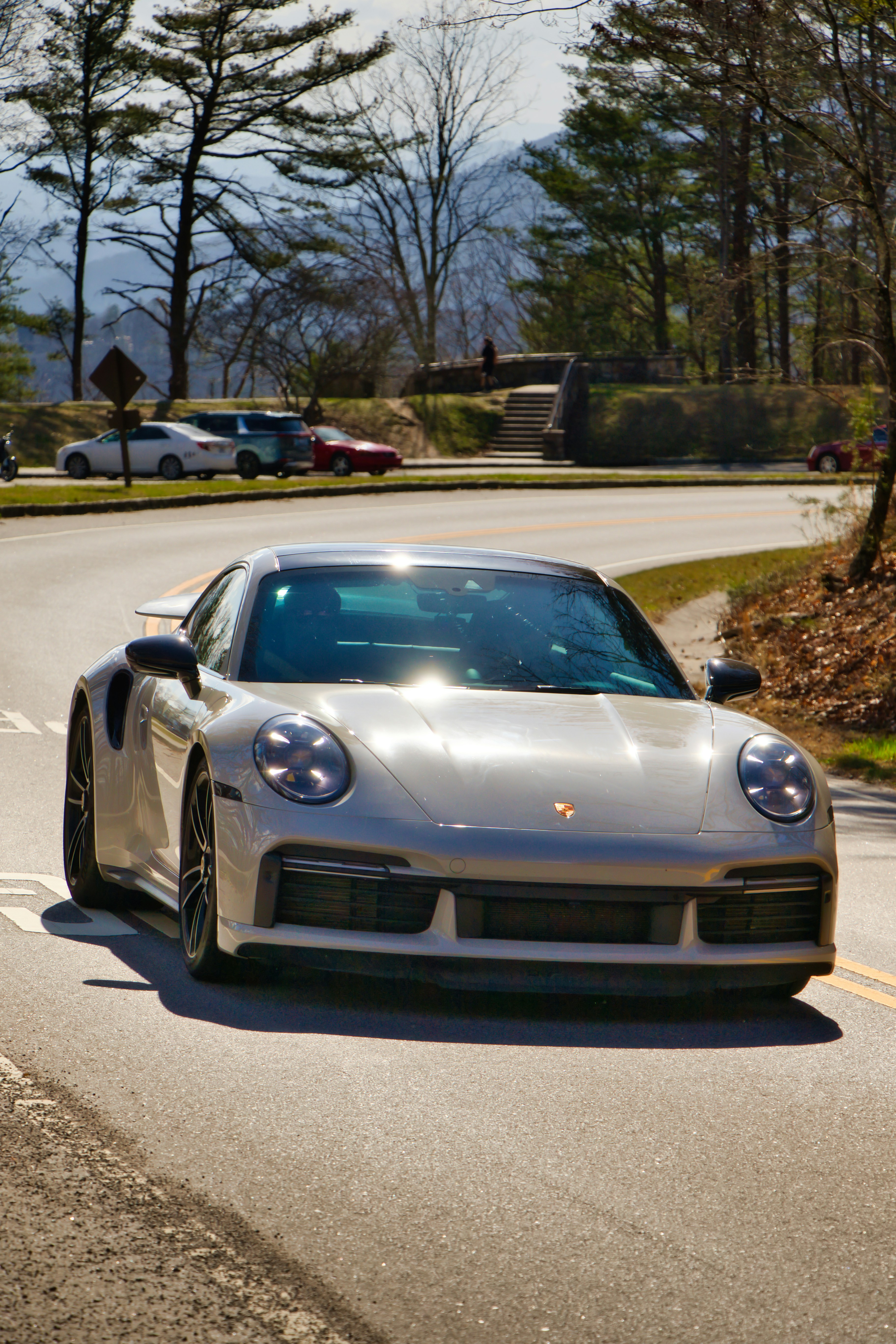 Silver Porsche Leads the Scenic Curves