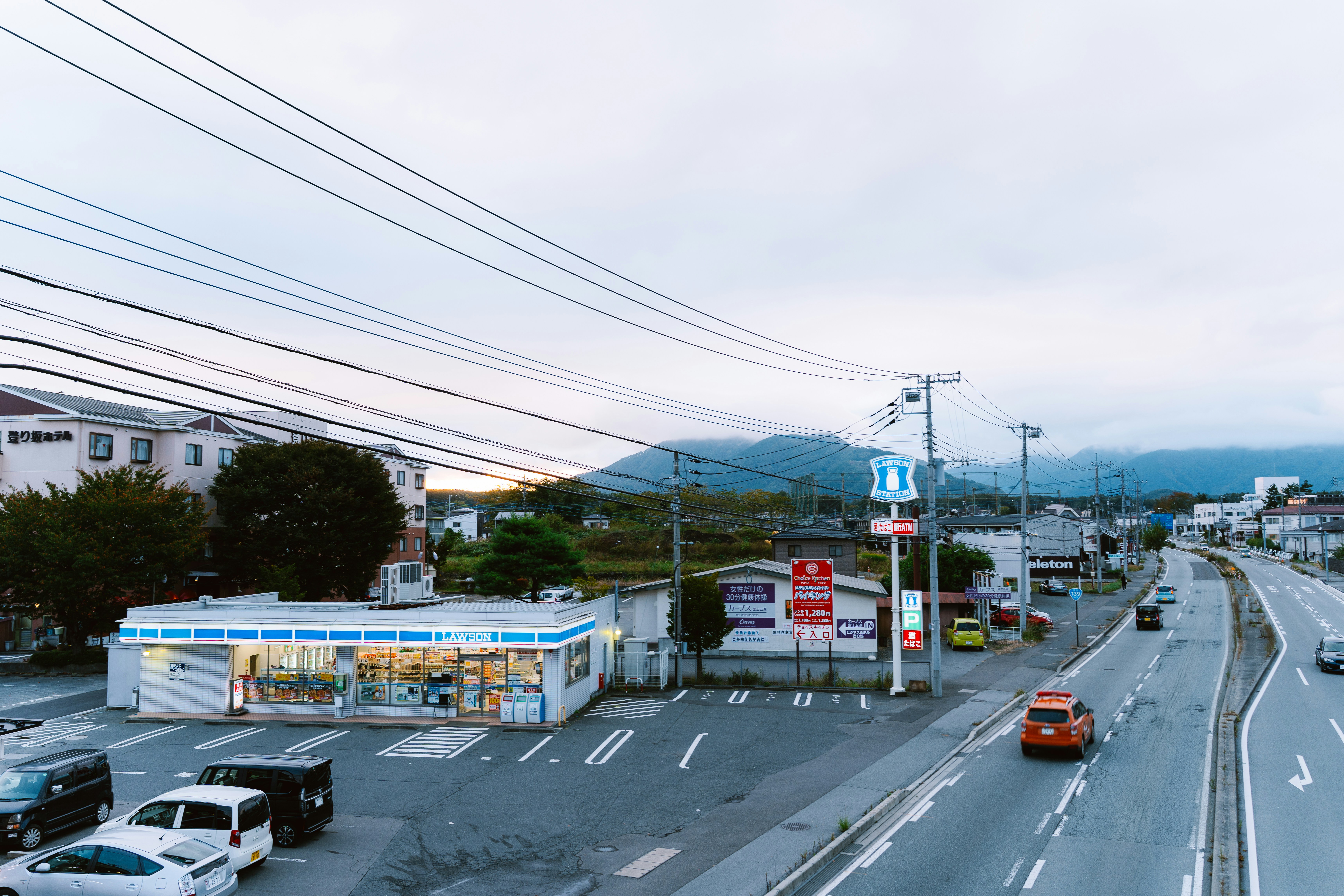 Convenience store on a street corner at dusk