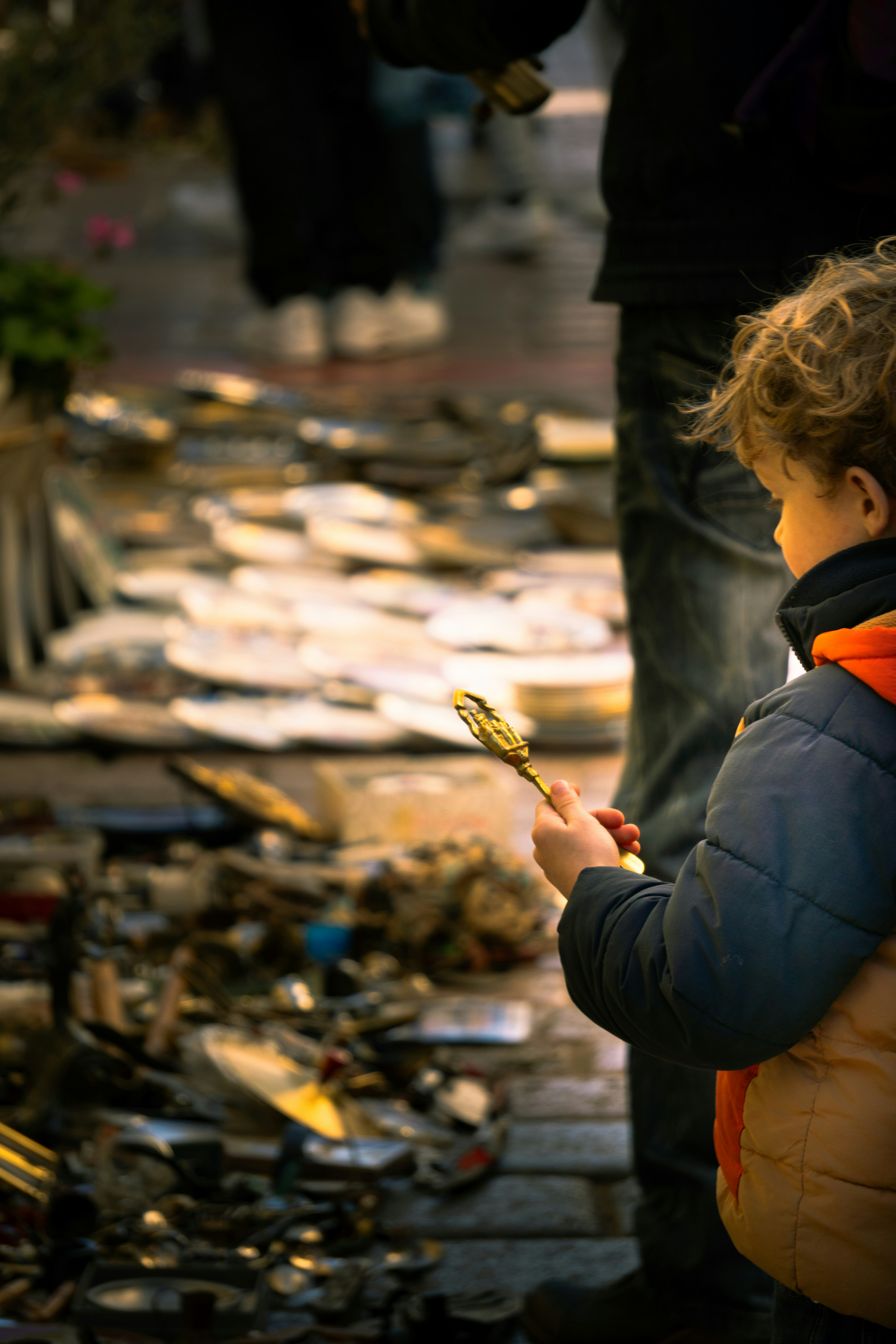 Toy Torch and Fallen Shoes: A Quiet Moment Among the Street Stills