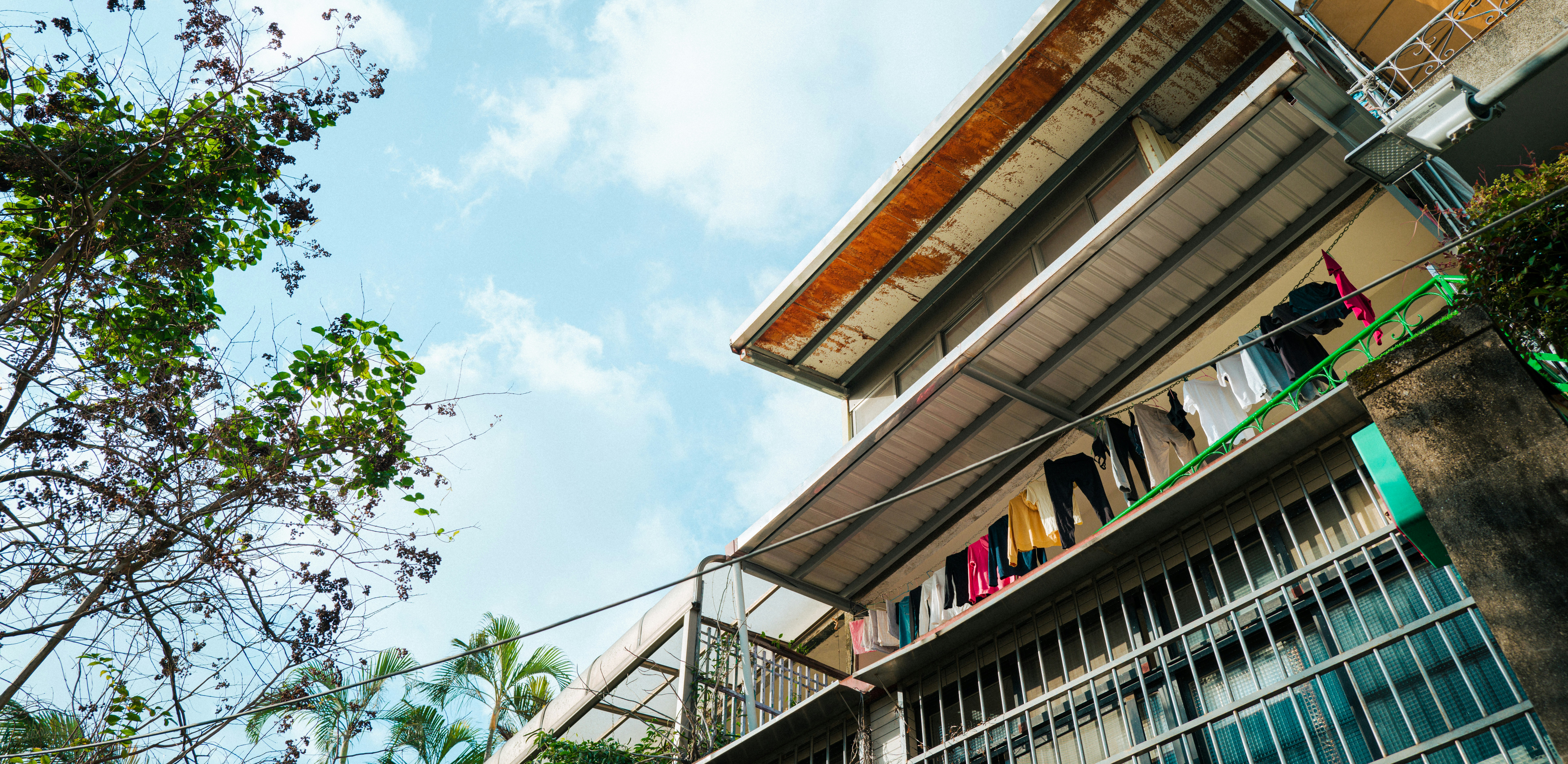 Laundry Day Beneath a Sky-Blue Canopy