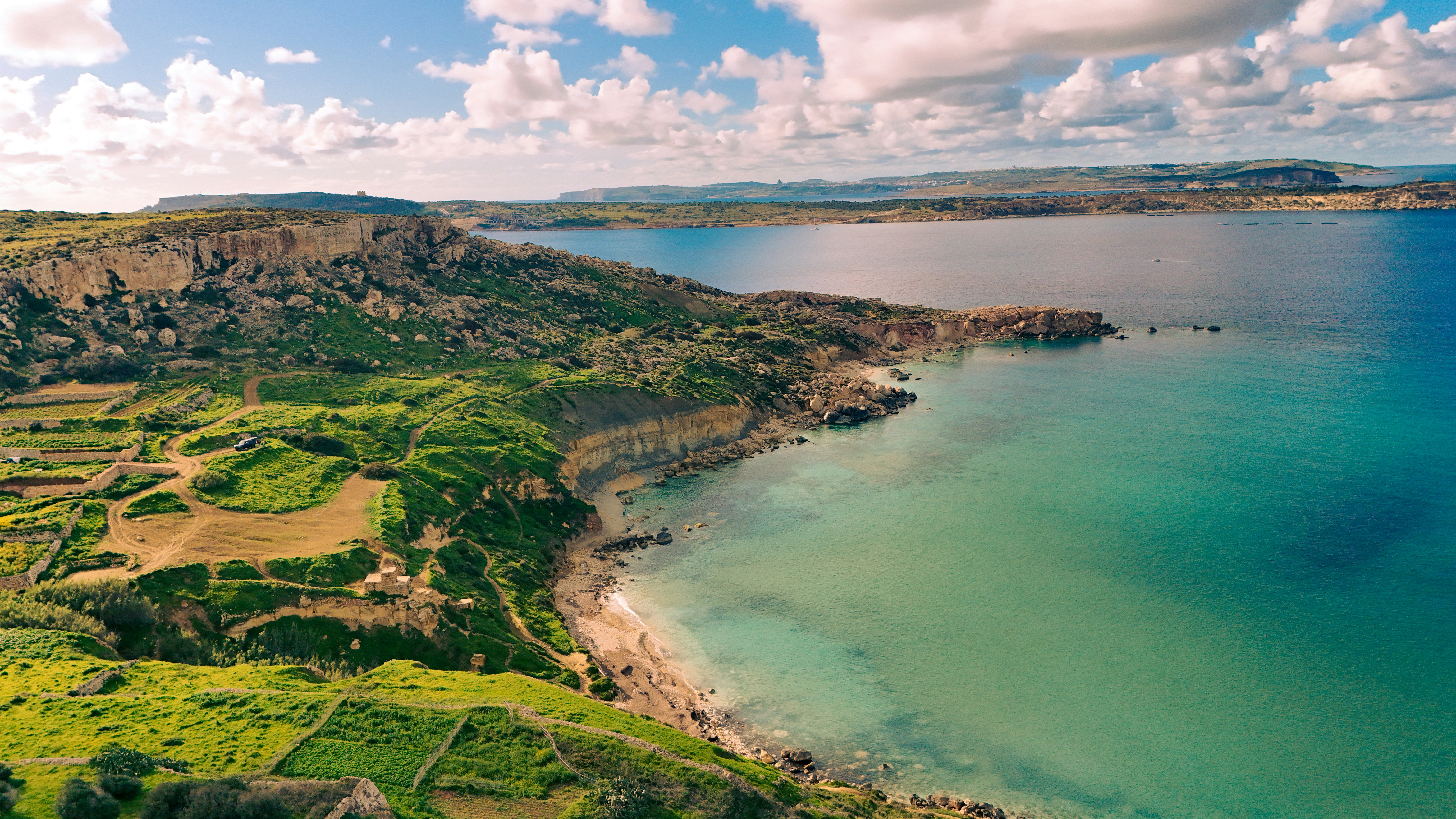 Sun-Kissed Blufflines over Turquoise Cove