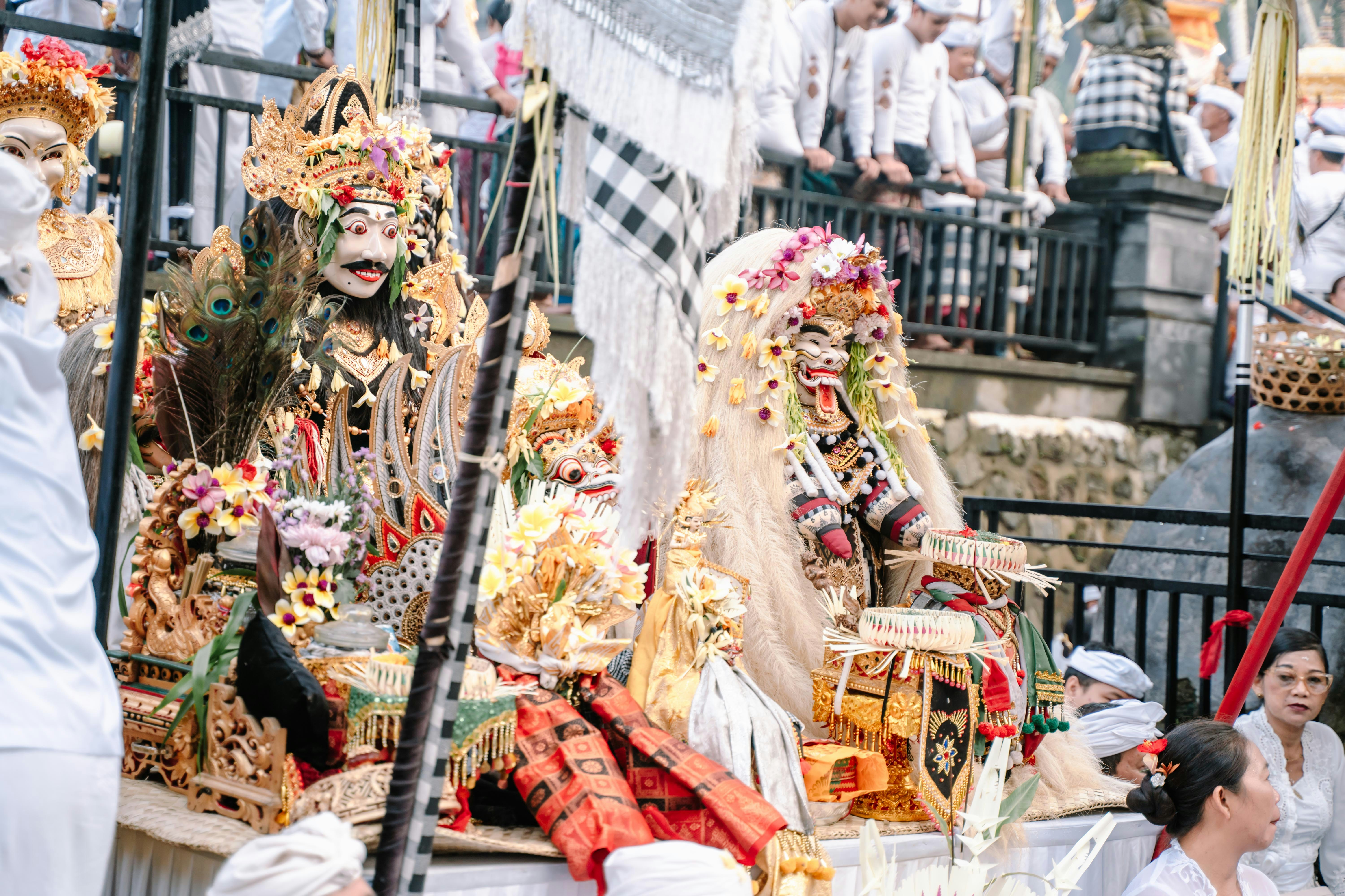 Masked Solemnity: Festival Dancers in Ornate Gold on Steps