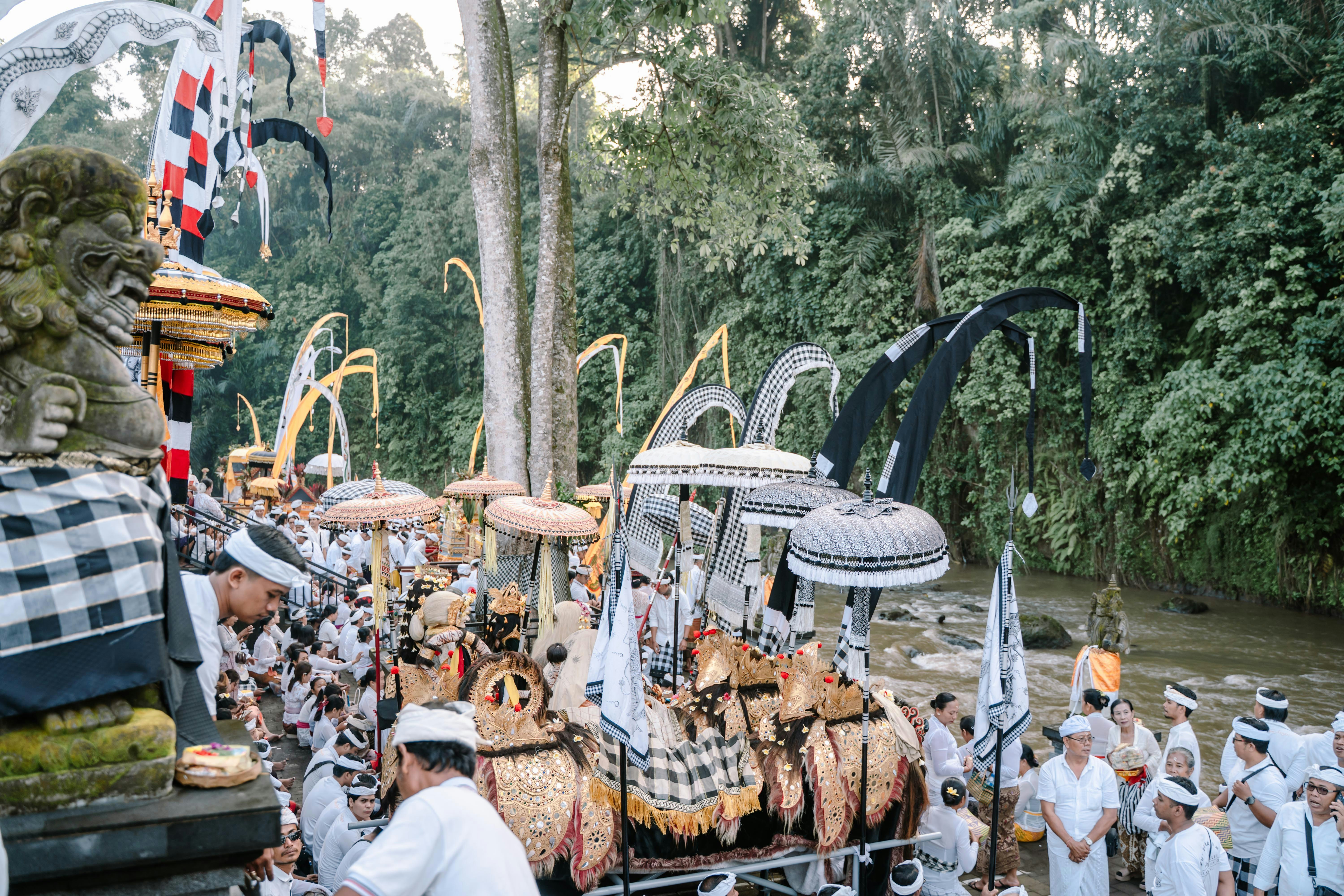 Procession by the Riverside: Ornate Participants and Traditional Paraphernalia
