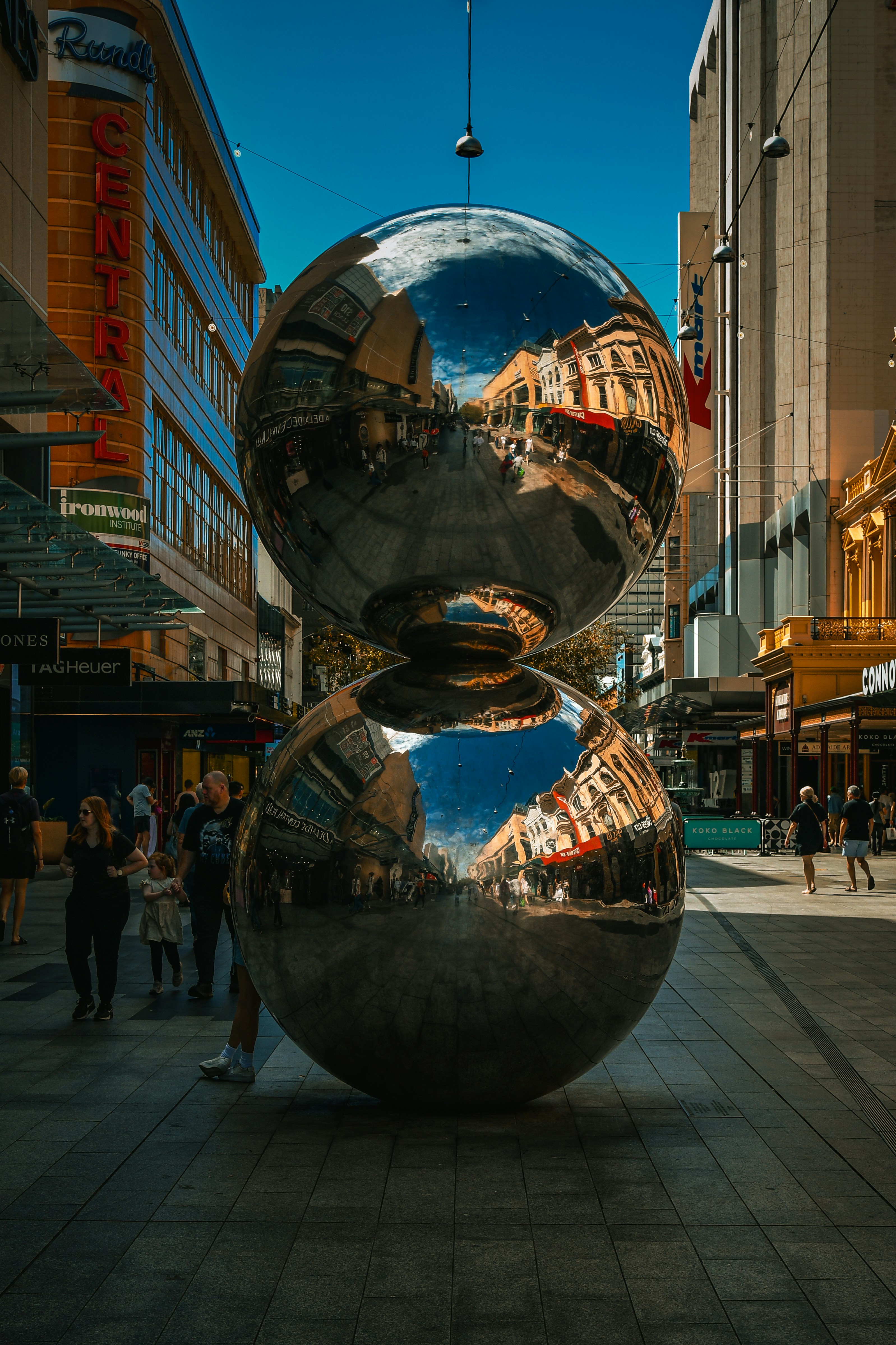 Descending Reflections: A City in a Sphere