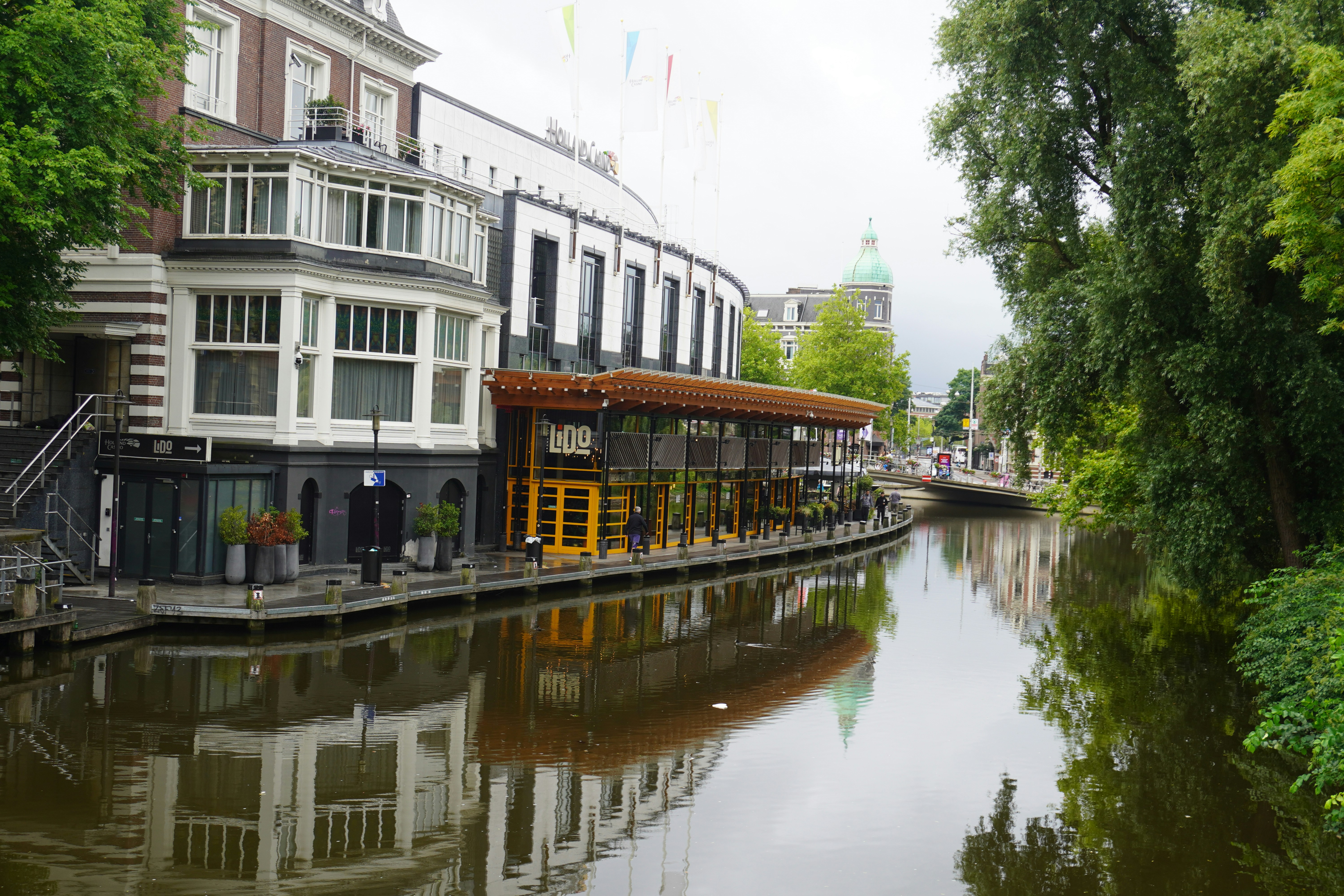 Canalfront Café Along a Reflective Waterway
