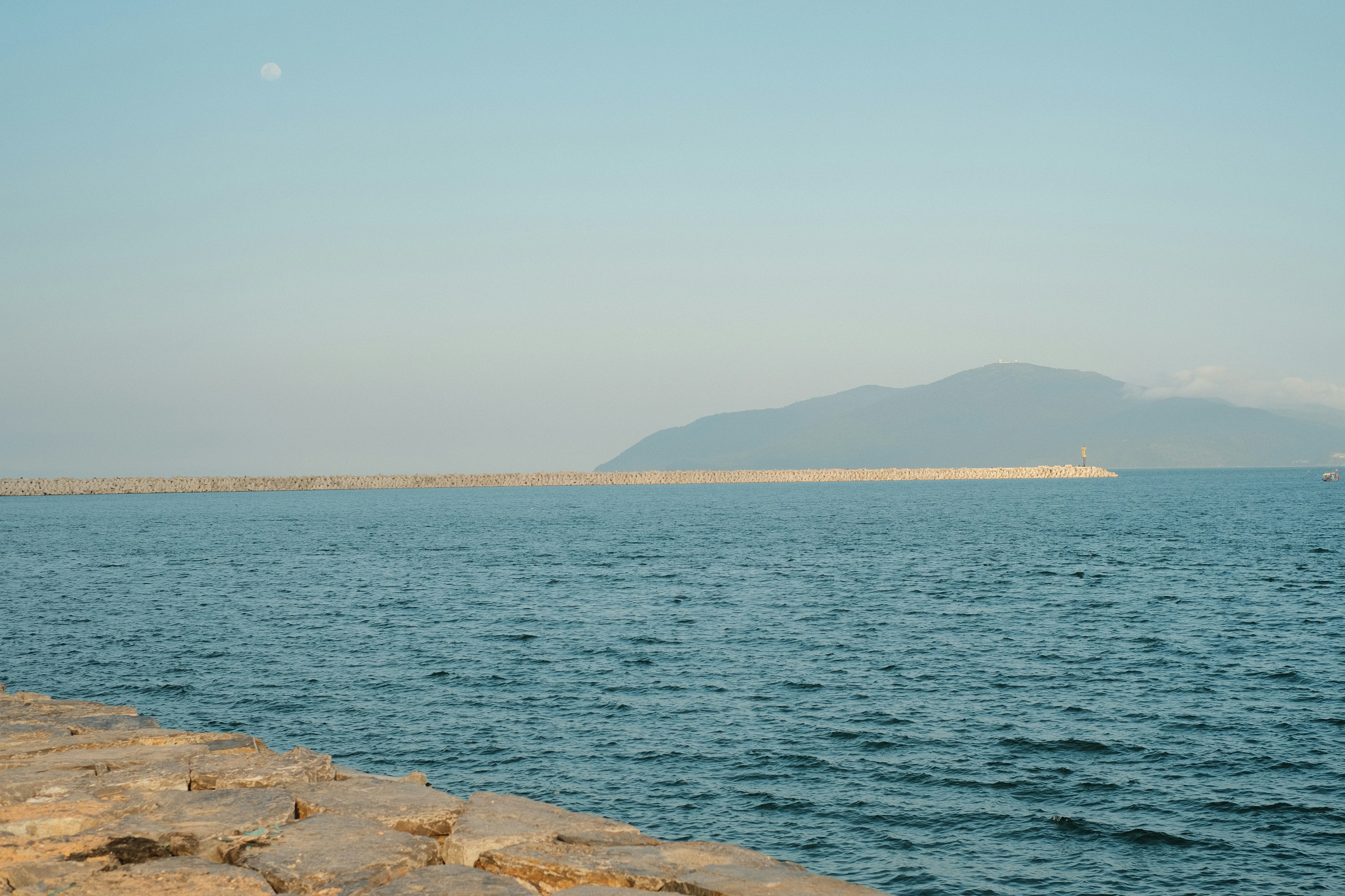 Harbor Breakwater Under a Quiet Sky