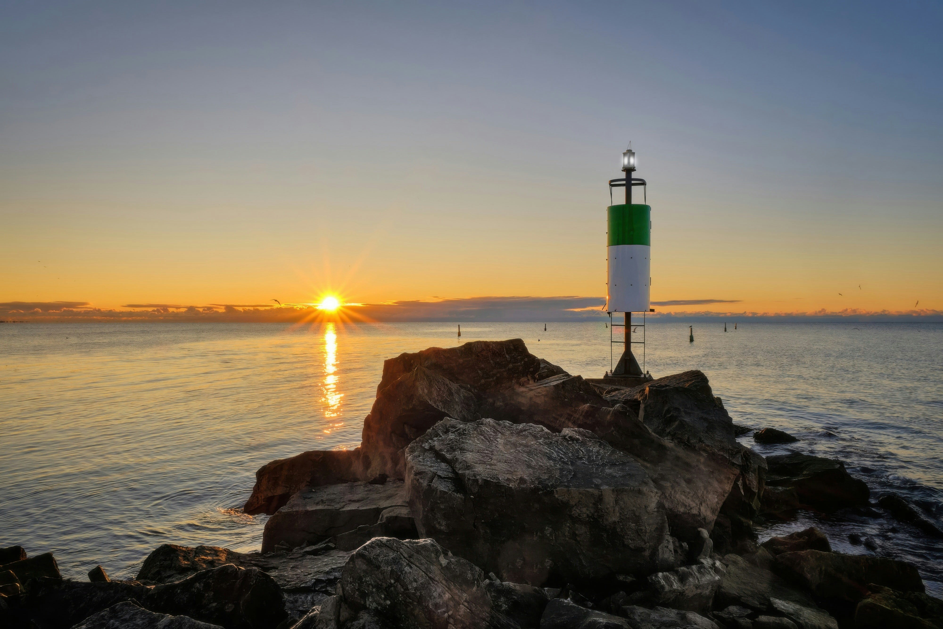 Dawn Breaks Over the Rocken Lighthouse