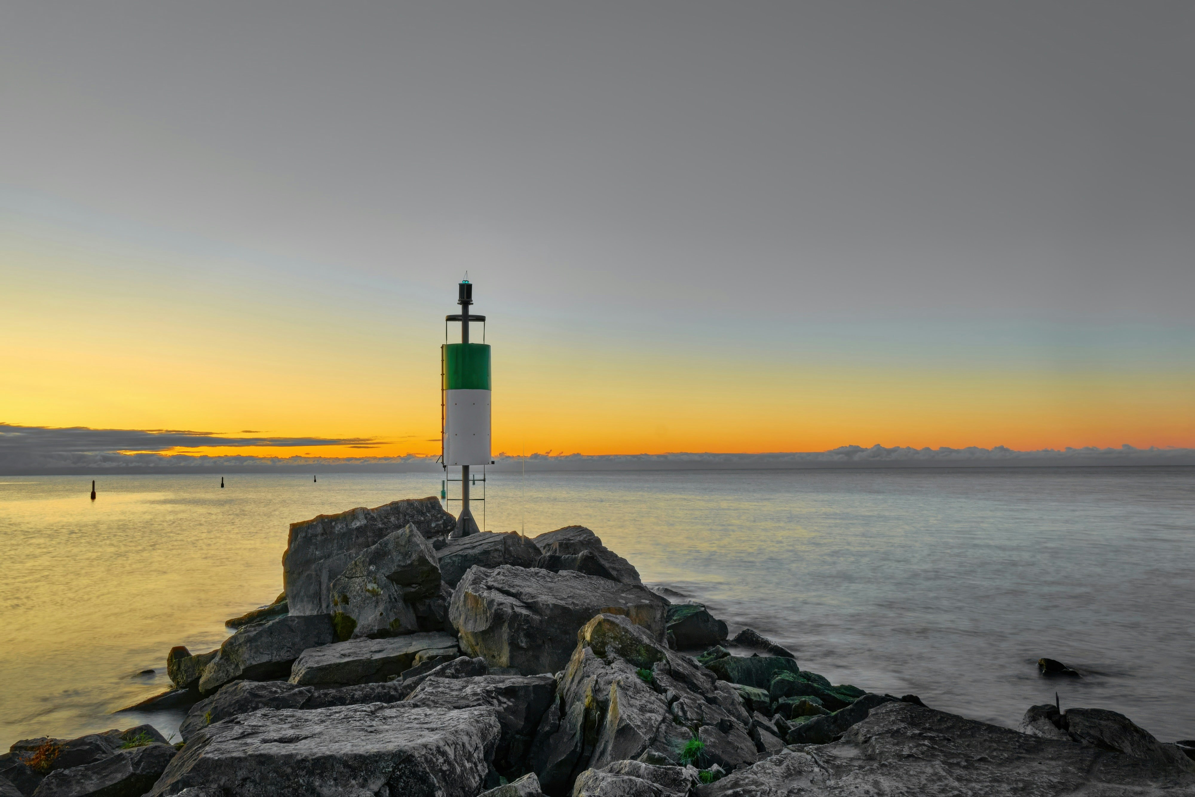 Harbor Beacon at Sunset: A Quiet Breakwater Raising the Horizon