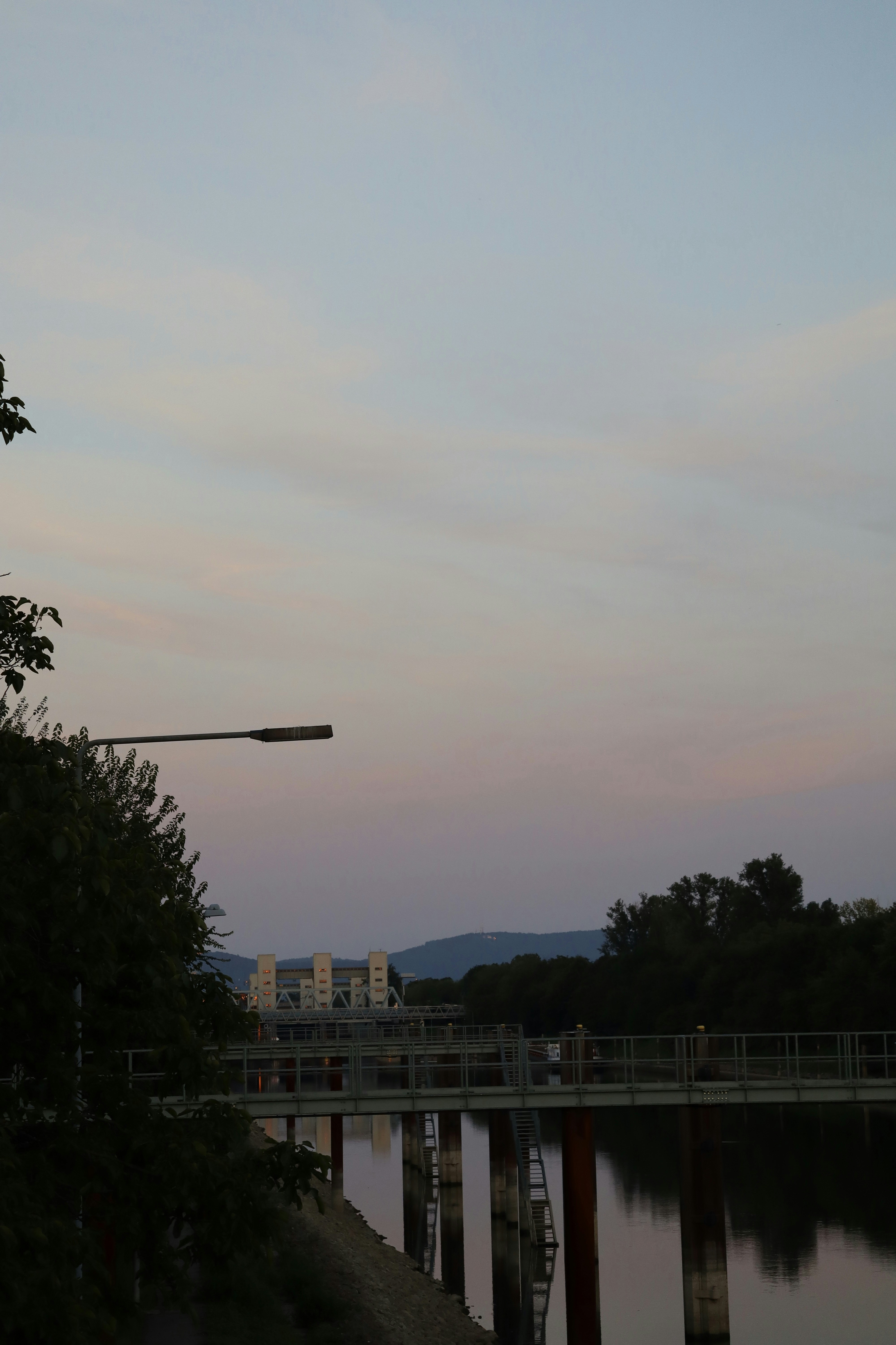 Quiet River Sky: Dusk Over the Bridge