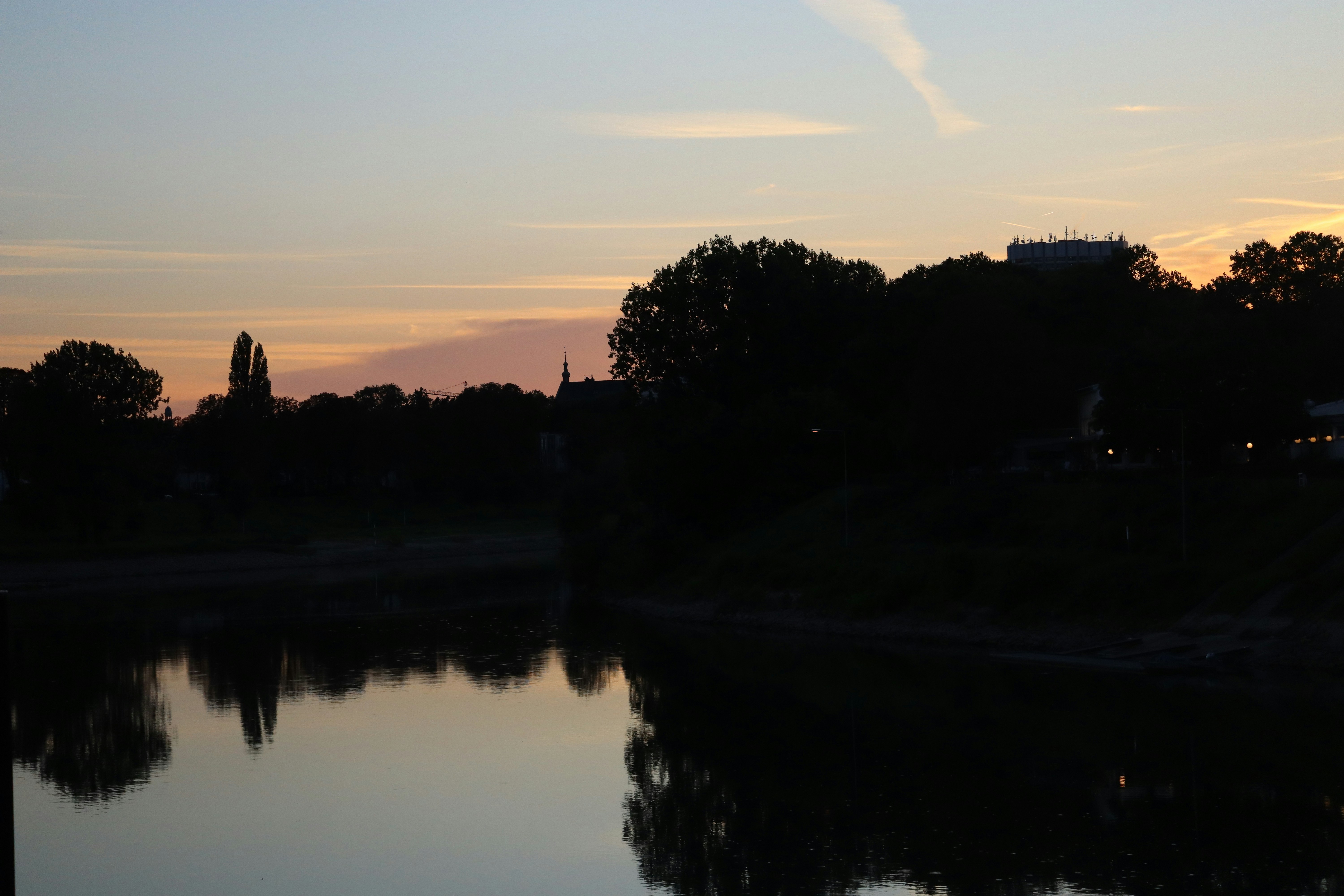 Dusk Silhouette Over a Quiet Riverside