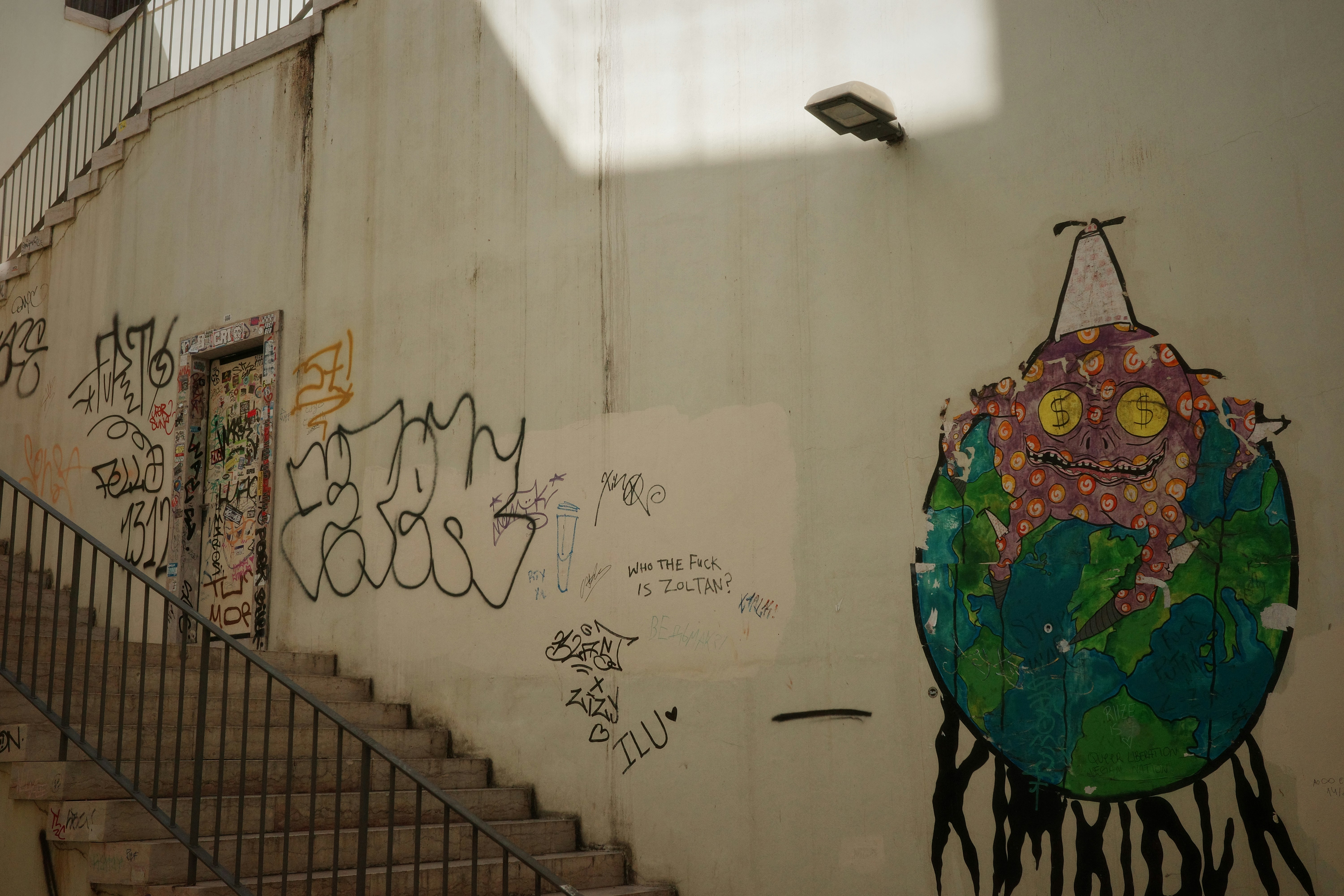Earthbound Graffiti: A Capsule of Urban Color on Concrete Steps