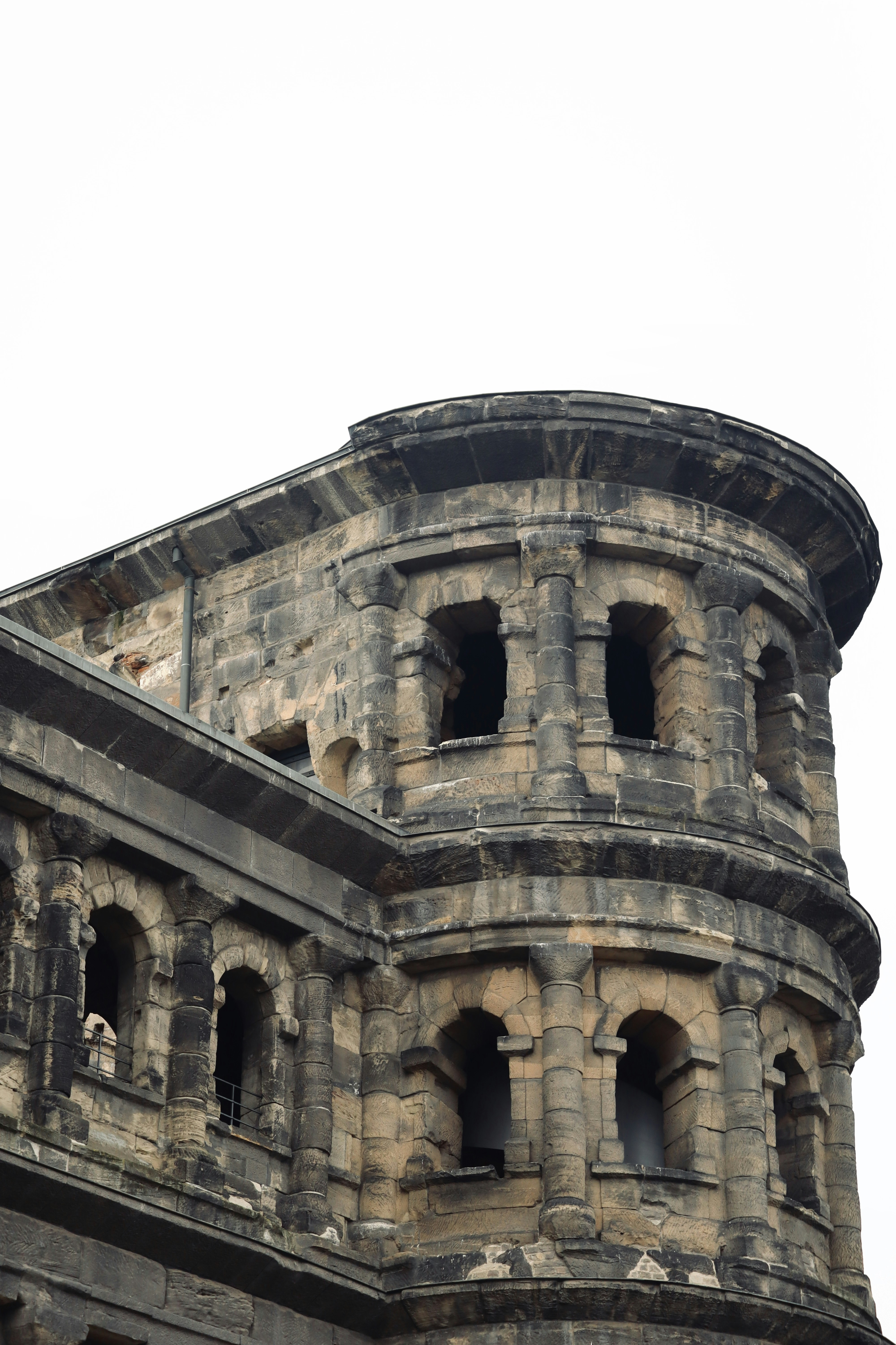 Curved Romanesque Facade: Weathered Arches of a Martian Fortress