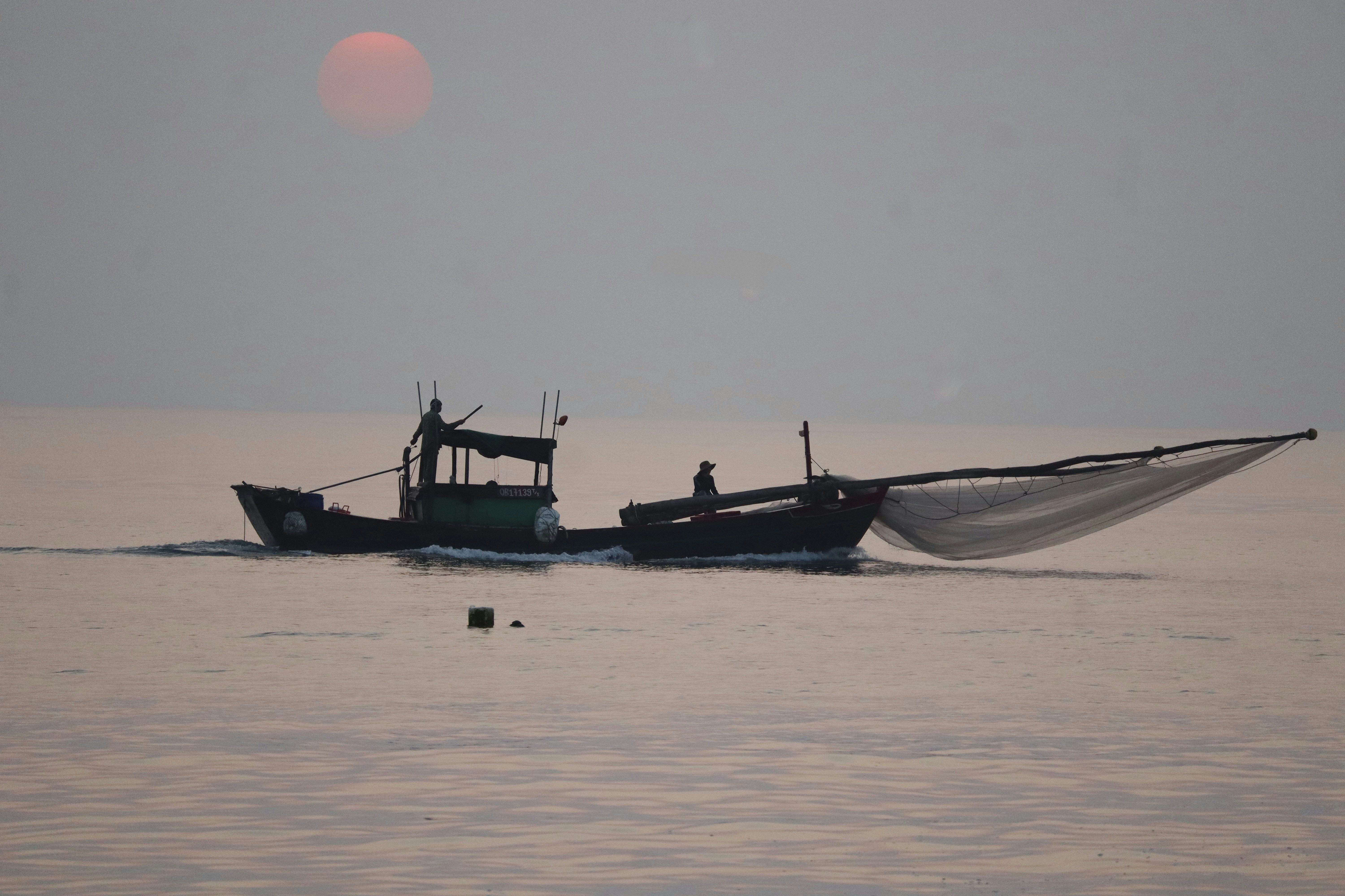 Distant Nets at Sunset: Twin Boats on Quiet Waters