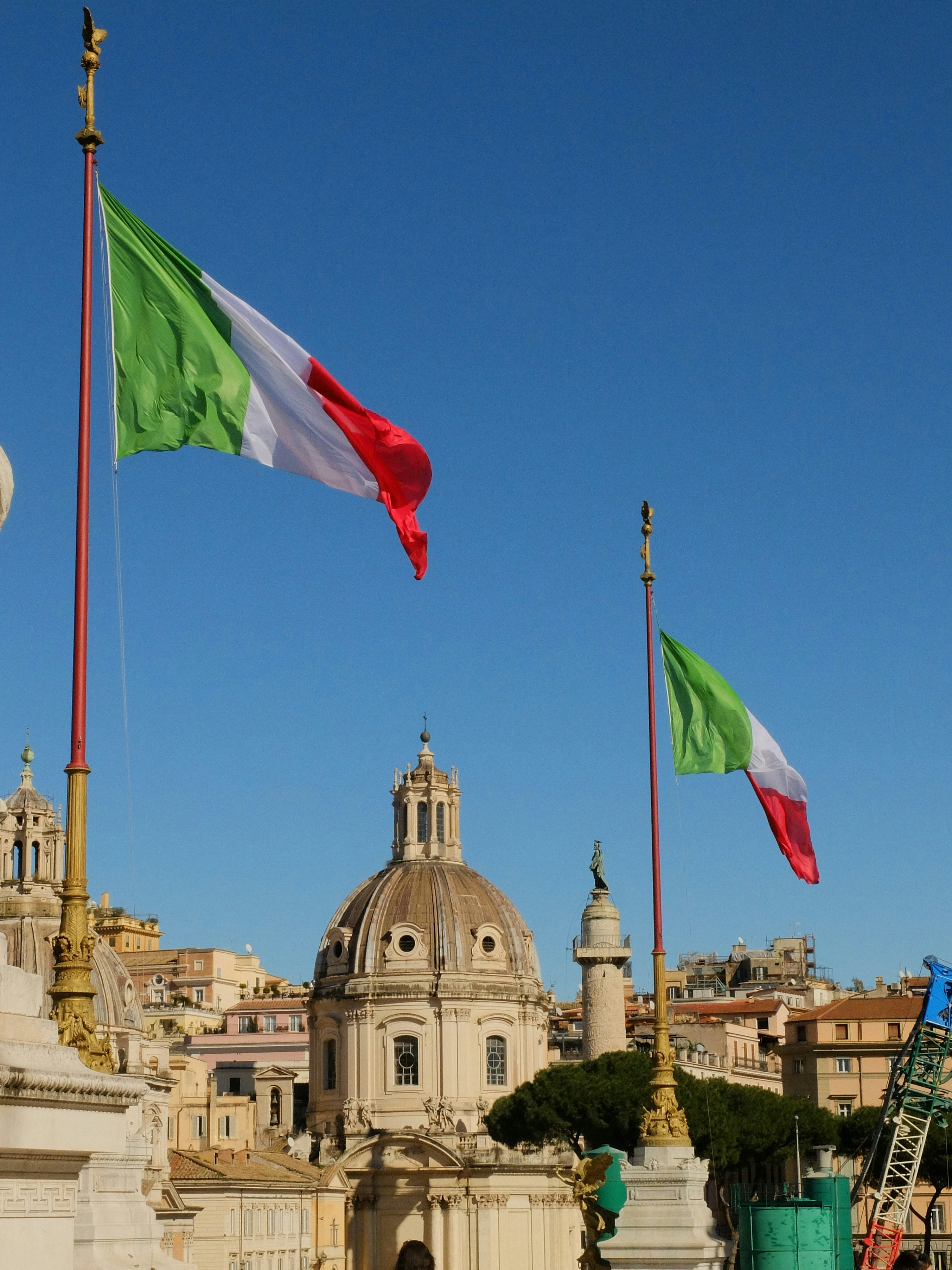 Flagstaffs and Dome: A Sunlit Roman Rooftop in Clear Blue