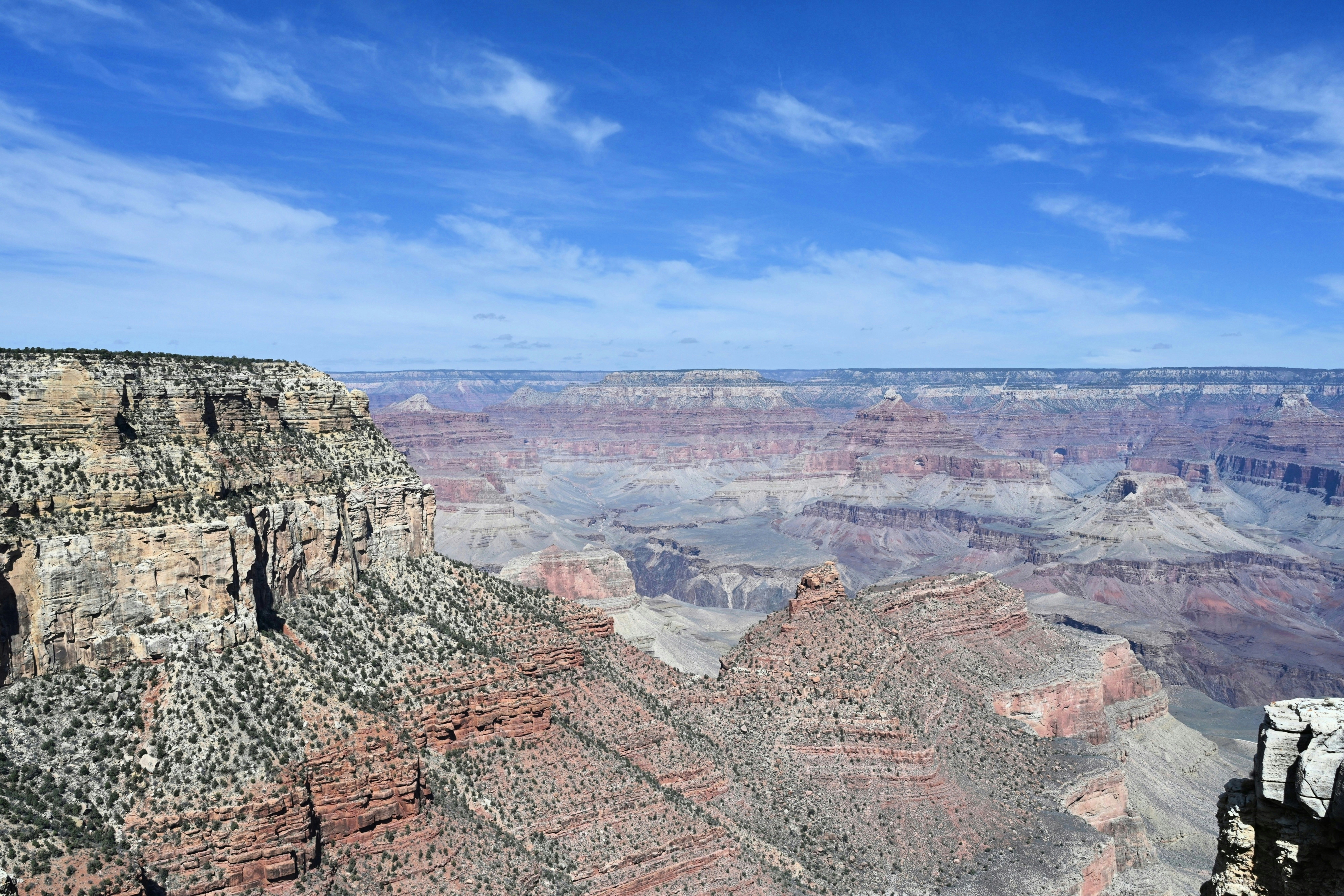 Edge of Time: A Canyon's Painted Strata Under a Cerulean Sky