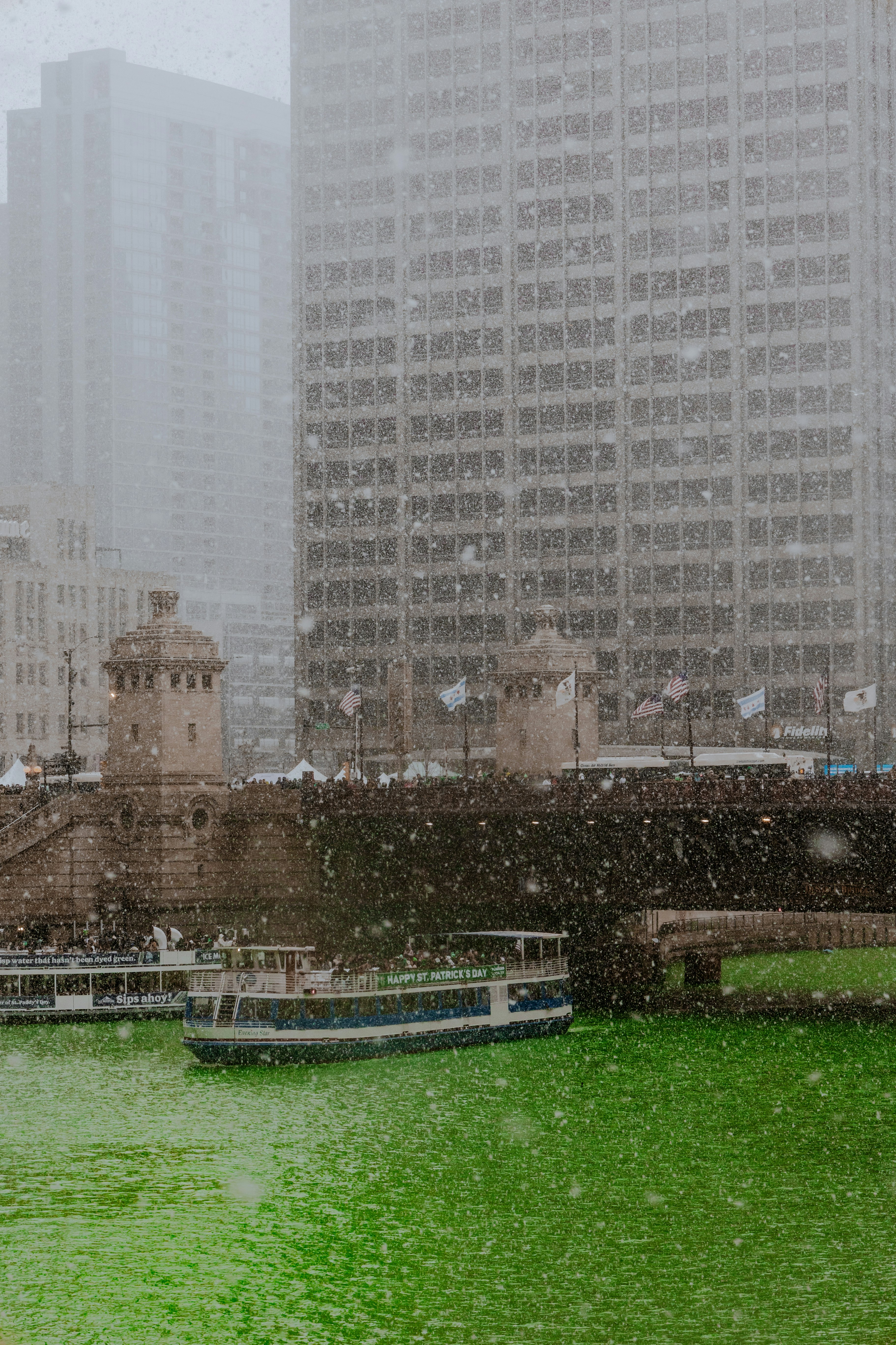 Emerald River: Snowfall Over a City Canal