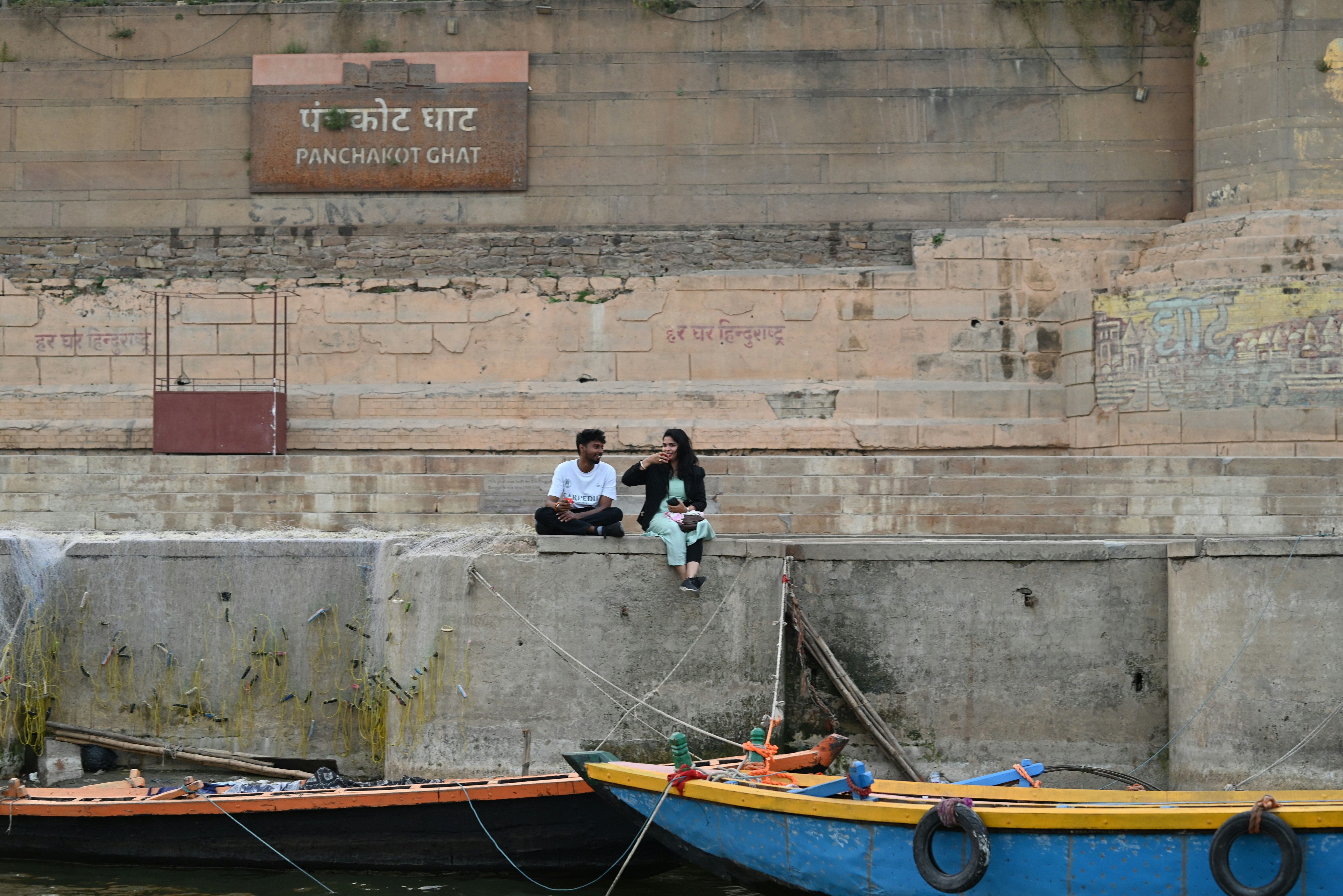 Neighbors on the Ghat: Quiet Conversation Above the Waterfront