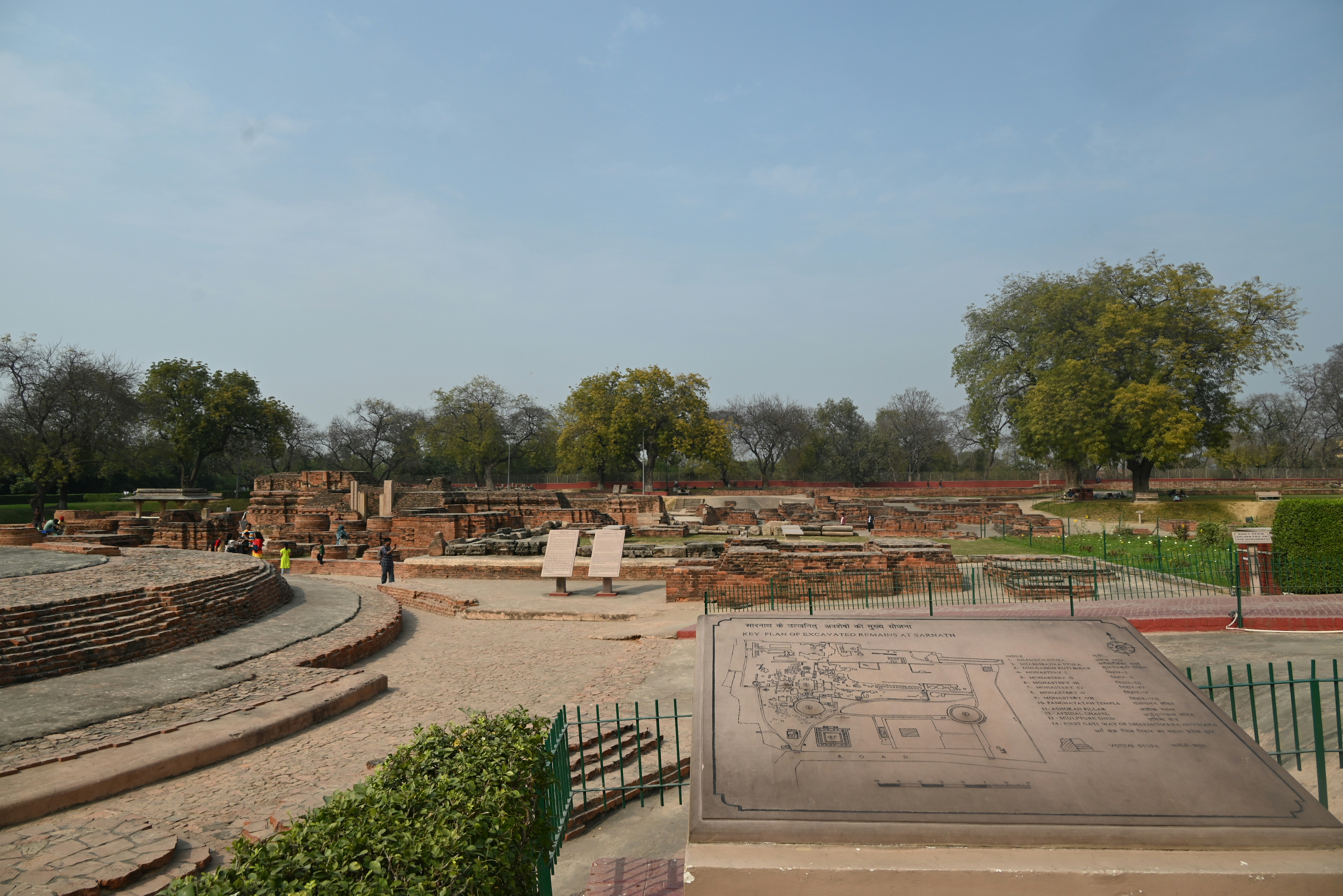 Stone Circles and Informational Plaque at an Ancient Ruin Courtyard