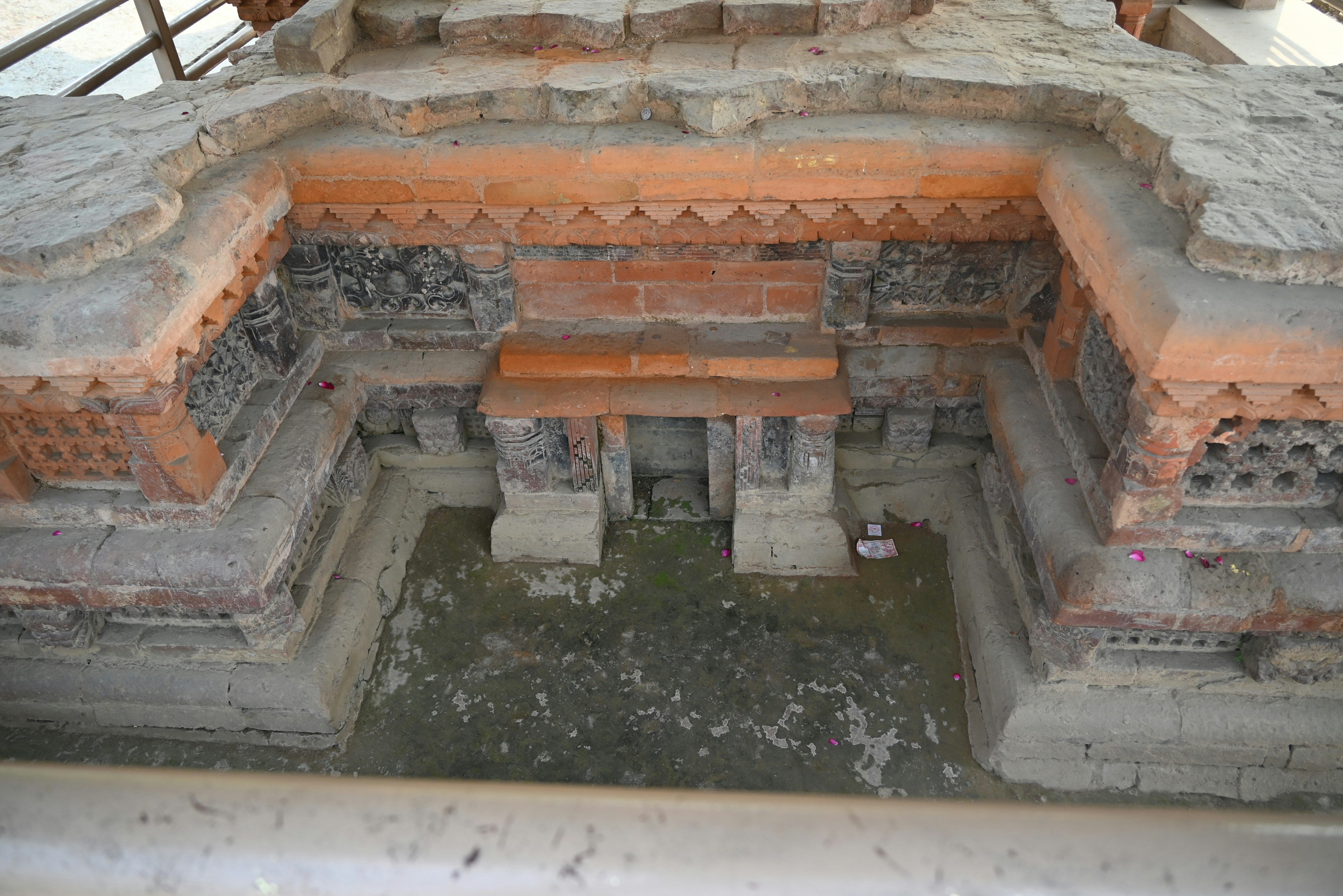 Ancient Temple Steps Receding into a Waterlogged Basin