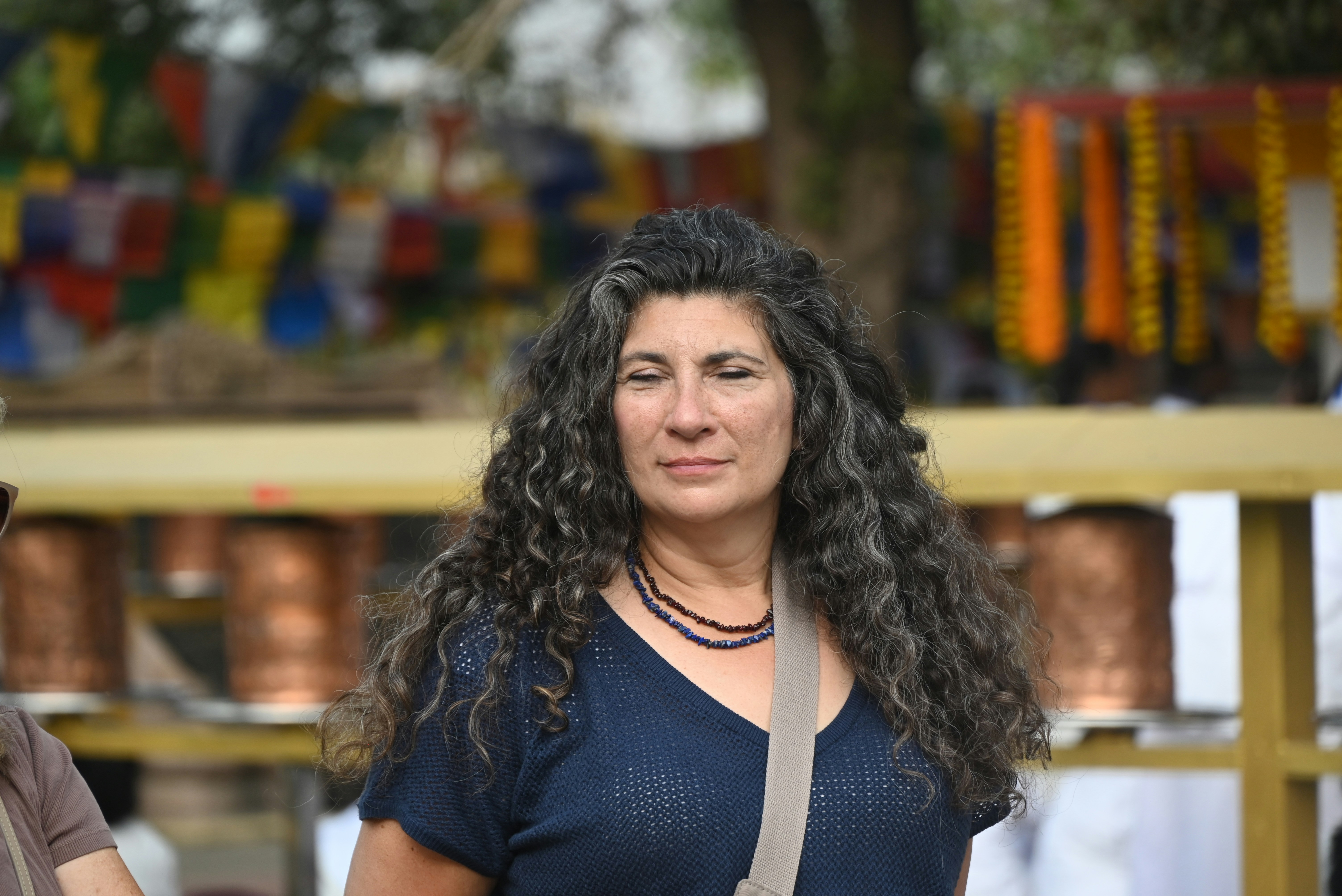 Center Stage: A Confident Presence Amid Colorful Temple Ambience