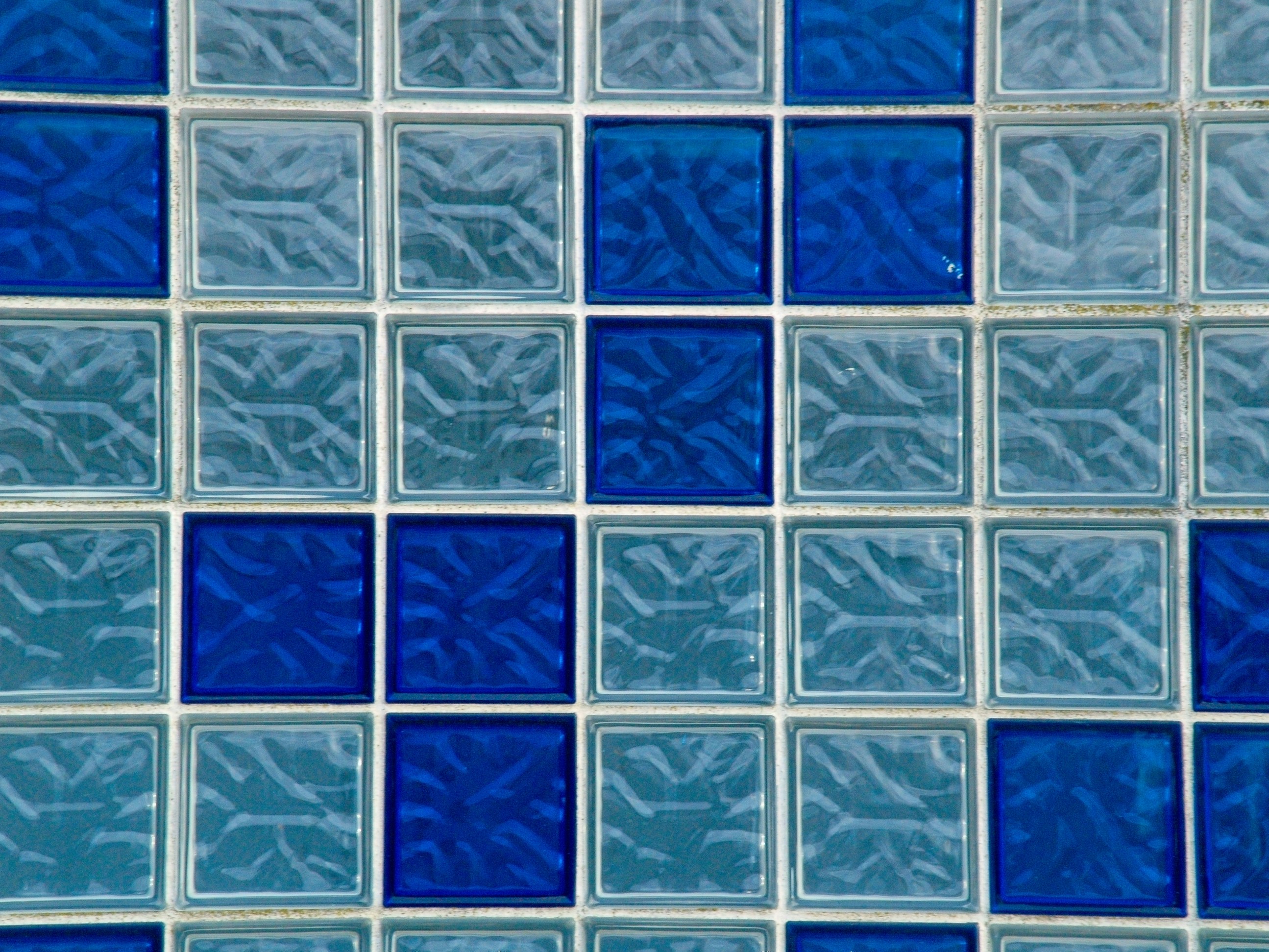 Blue Glass Mosaic Wells: a grid of teal and cobalt squares