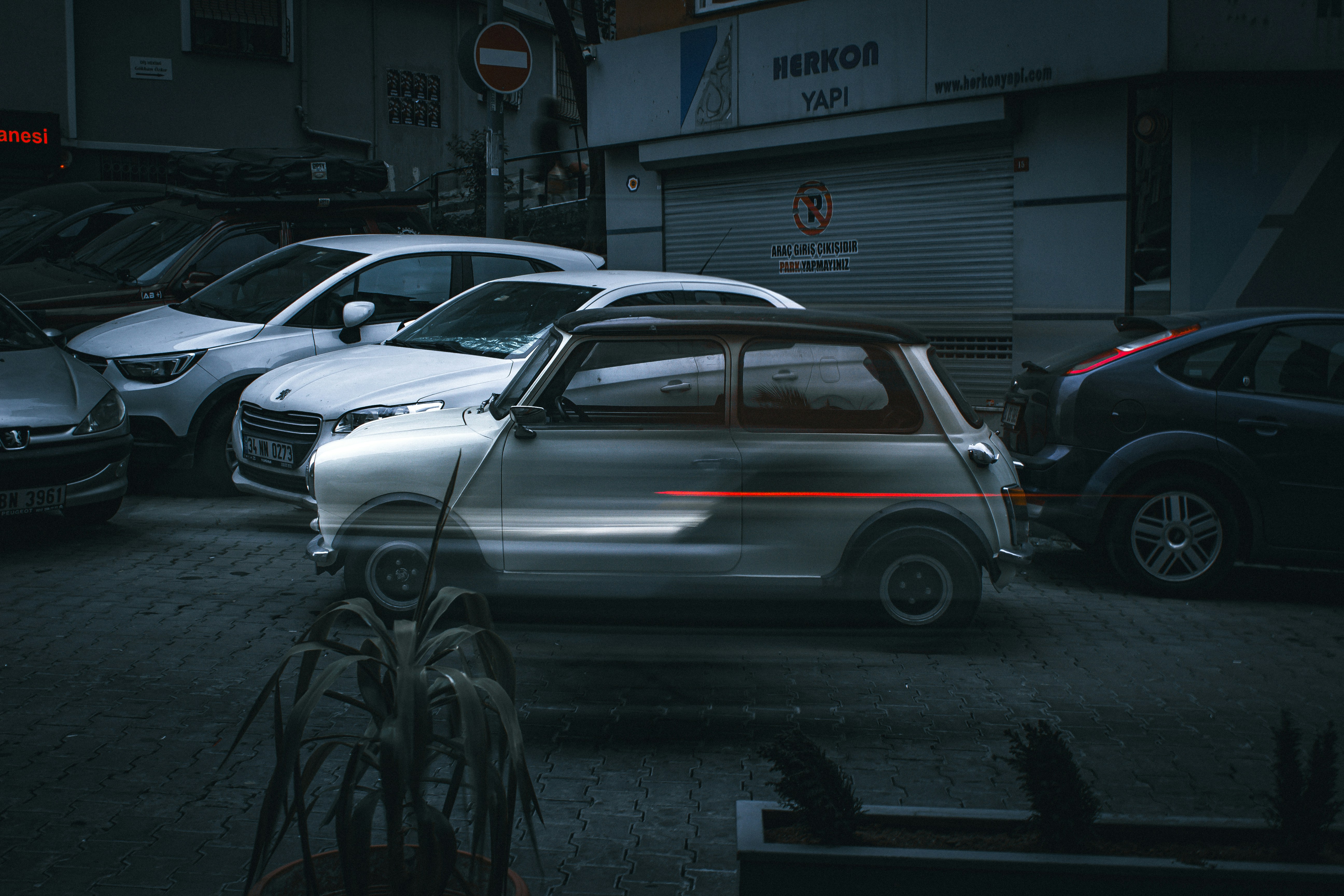 Midday in the Quiet Alley: A Drumbeat of Cars and Glass