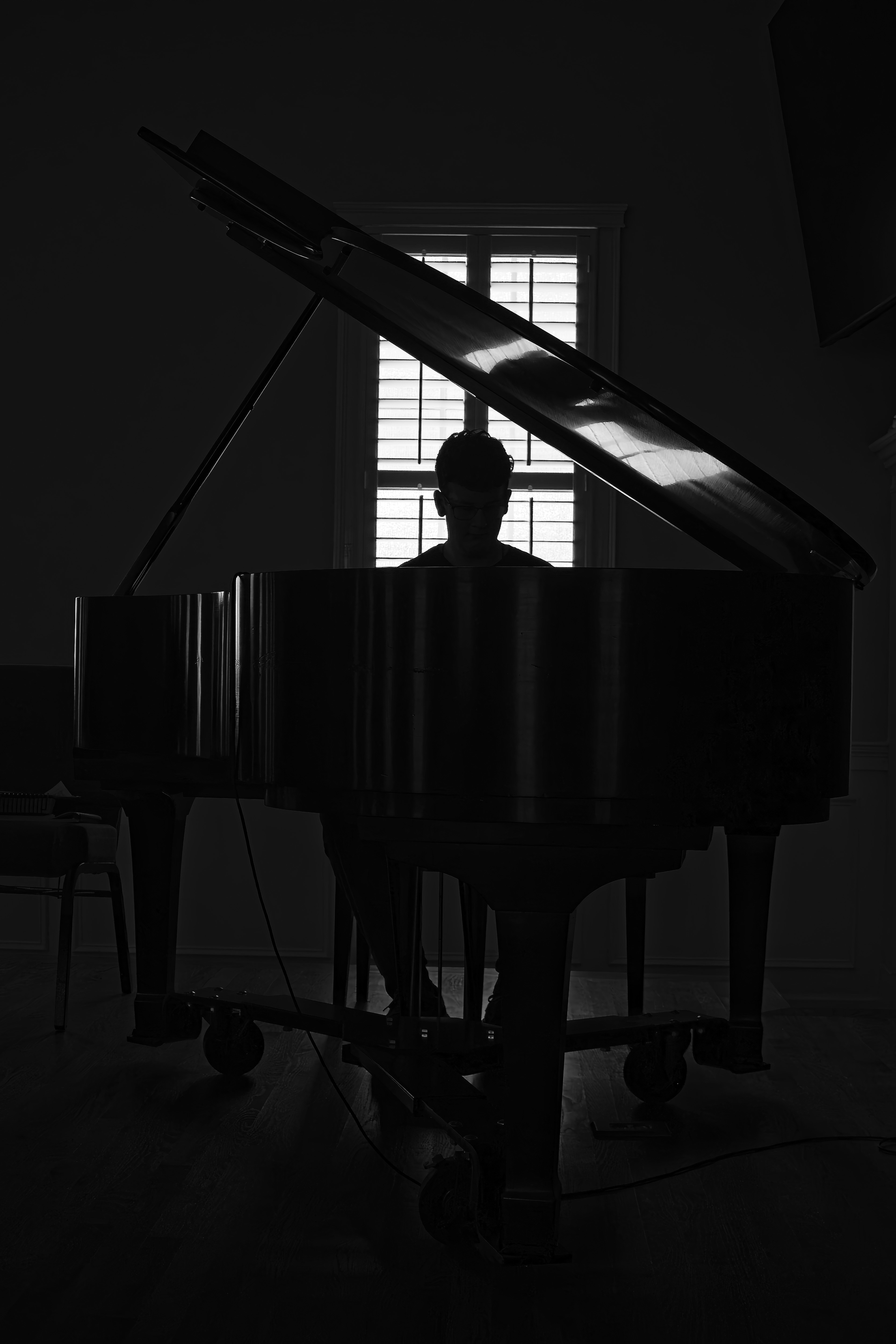 Midnight Sonata: A Pianist Hidden in Shadow