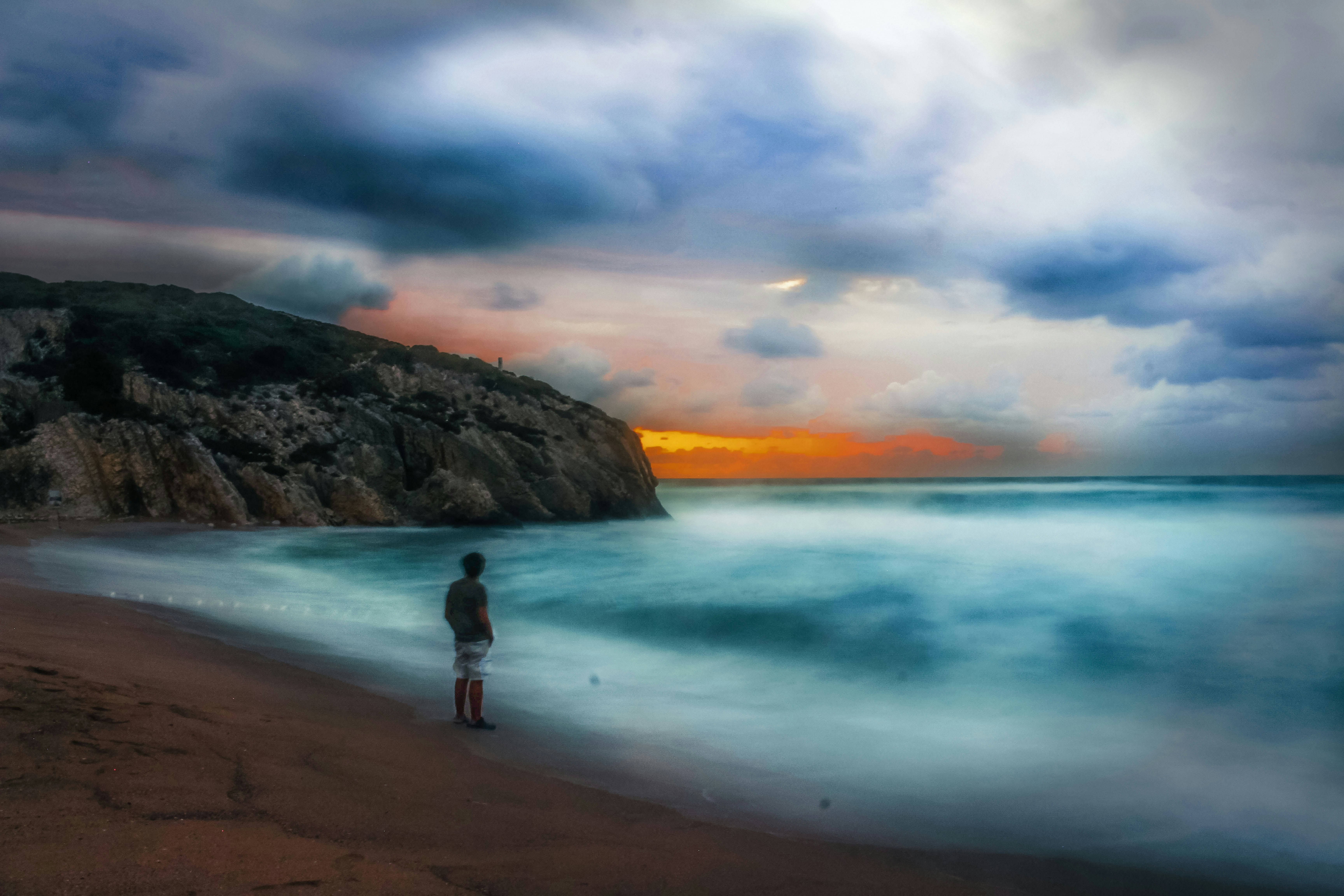 Lone Figure at Sunset’s Edge