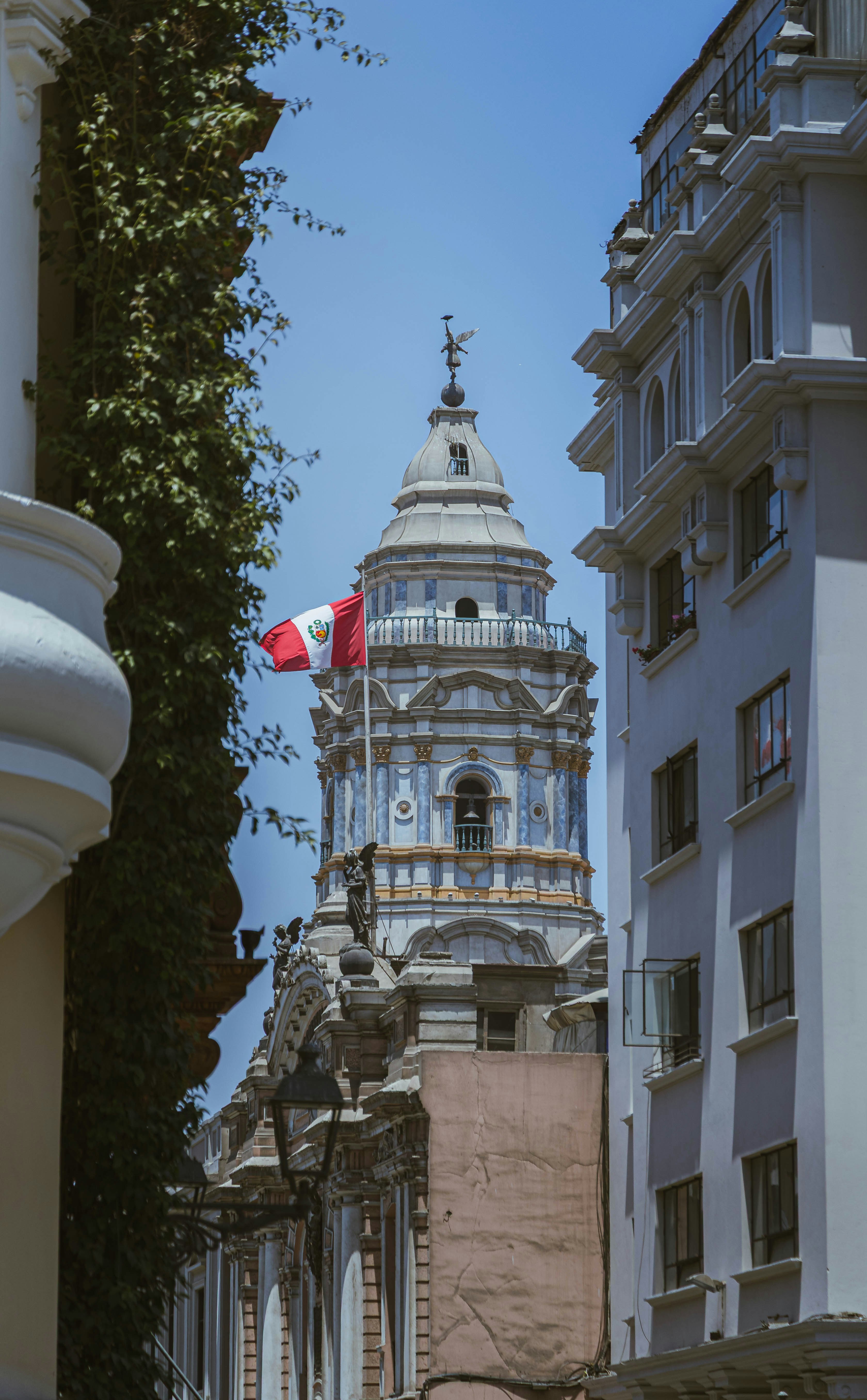 Blue Dome through the Narrow Calle: A Mexican City Clocktower Rising Above