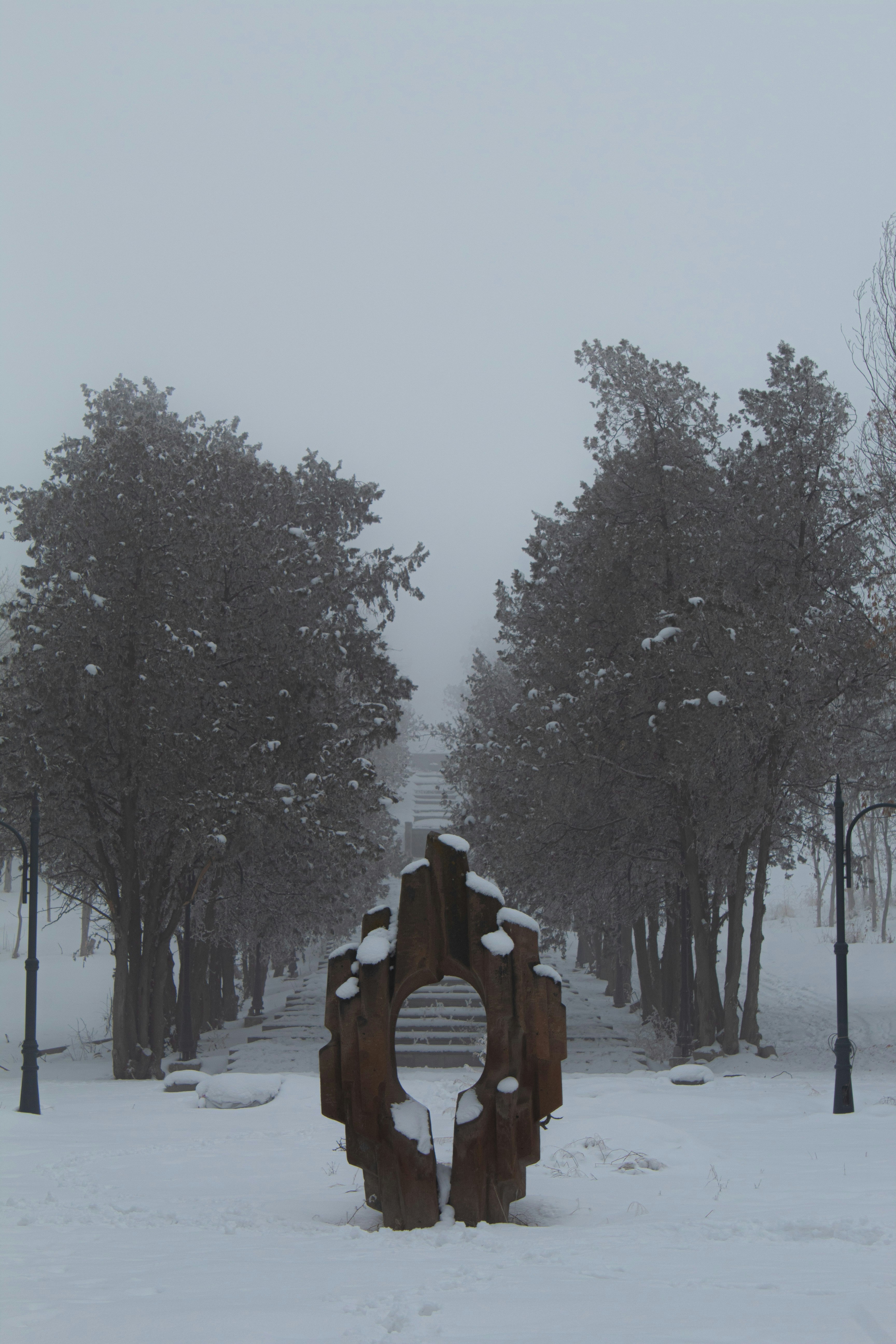 Snowbound Arc: The Central Monument Emerges Through a Winter Milieu