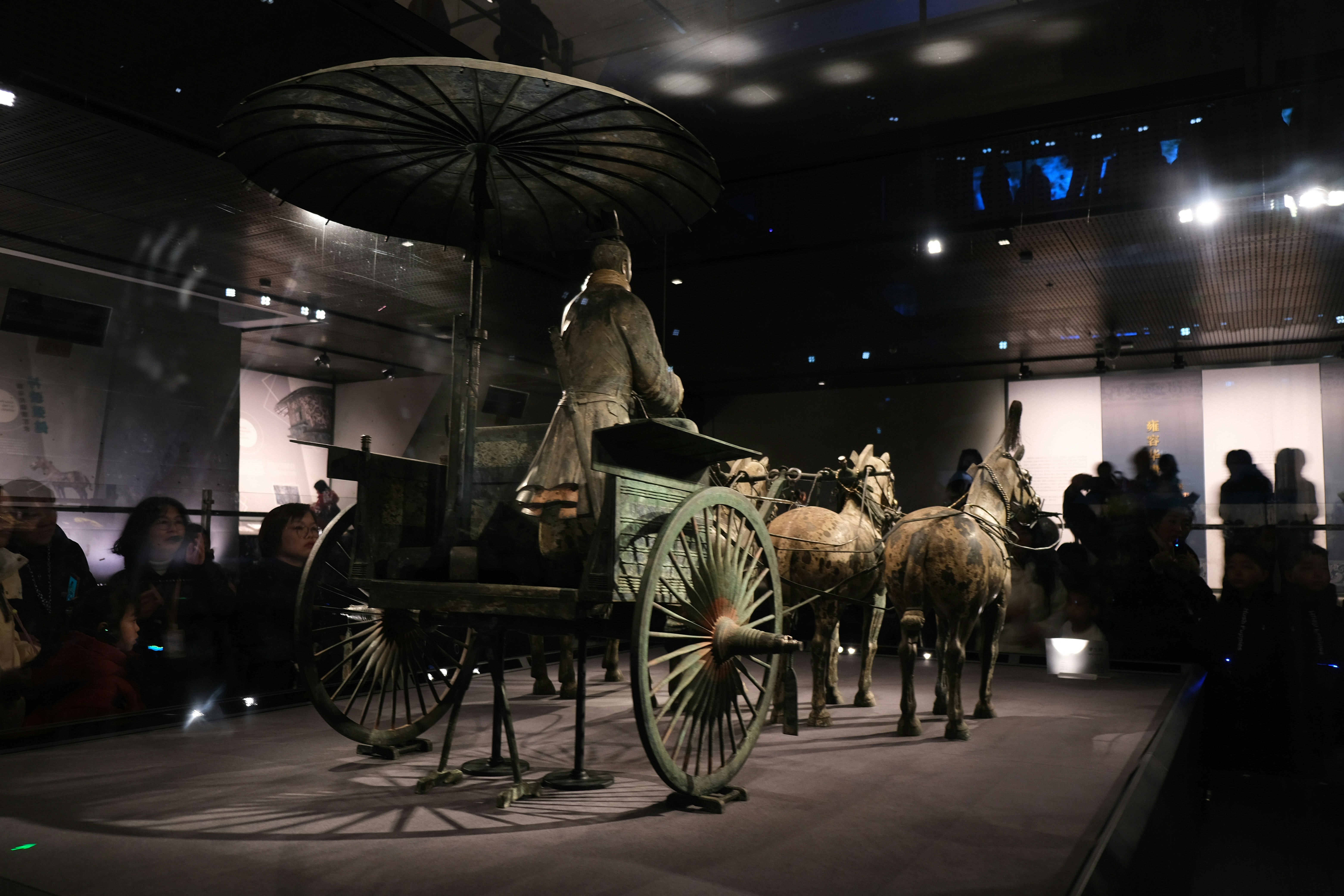 Chariot and Figures: A Quiet Ride Through a Hall of History